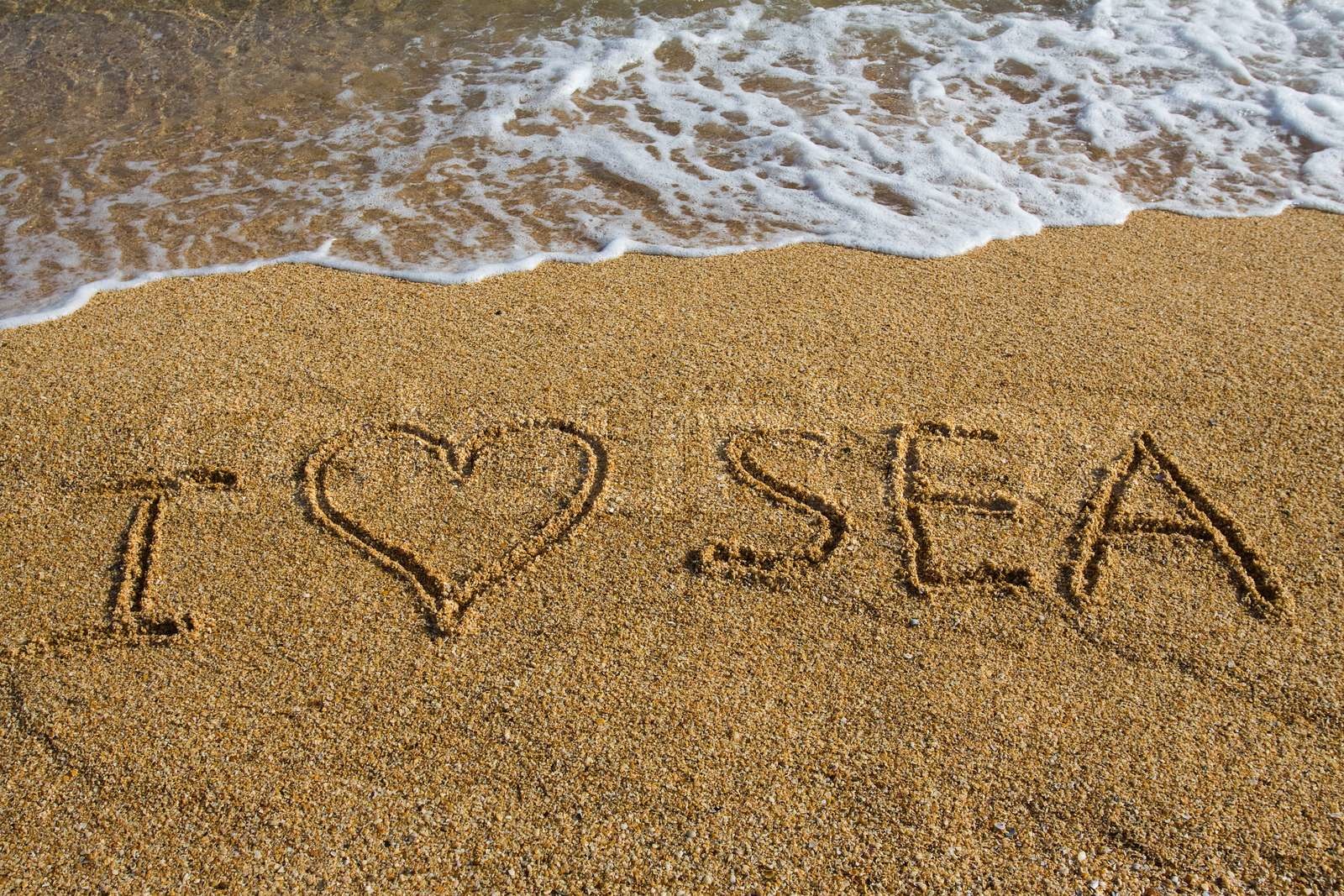 Simple word i love sea drawing in the sand on the beach. | Stock image ...