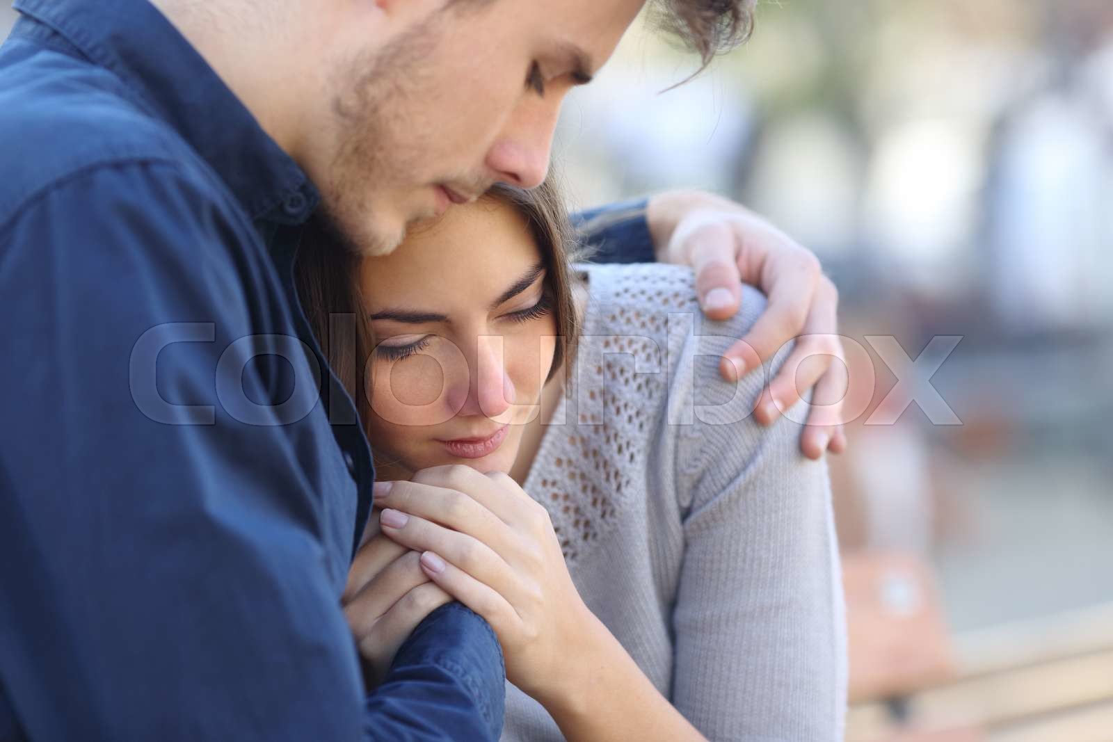 Man comforting his sad mourning friend | Stock image | Colourbox