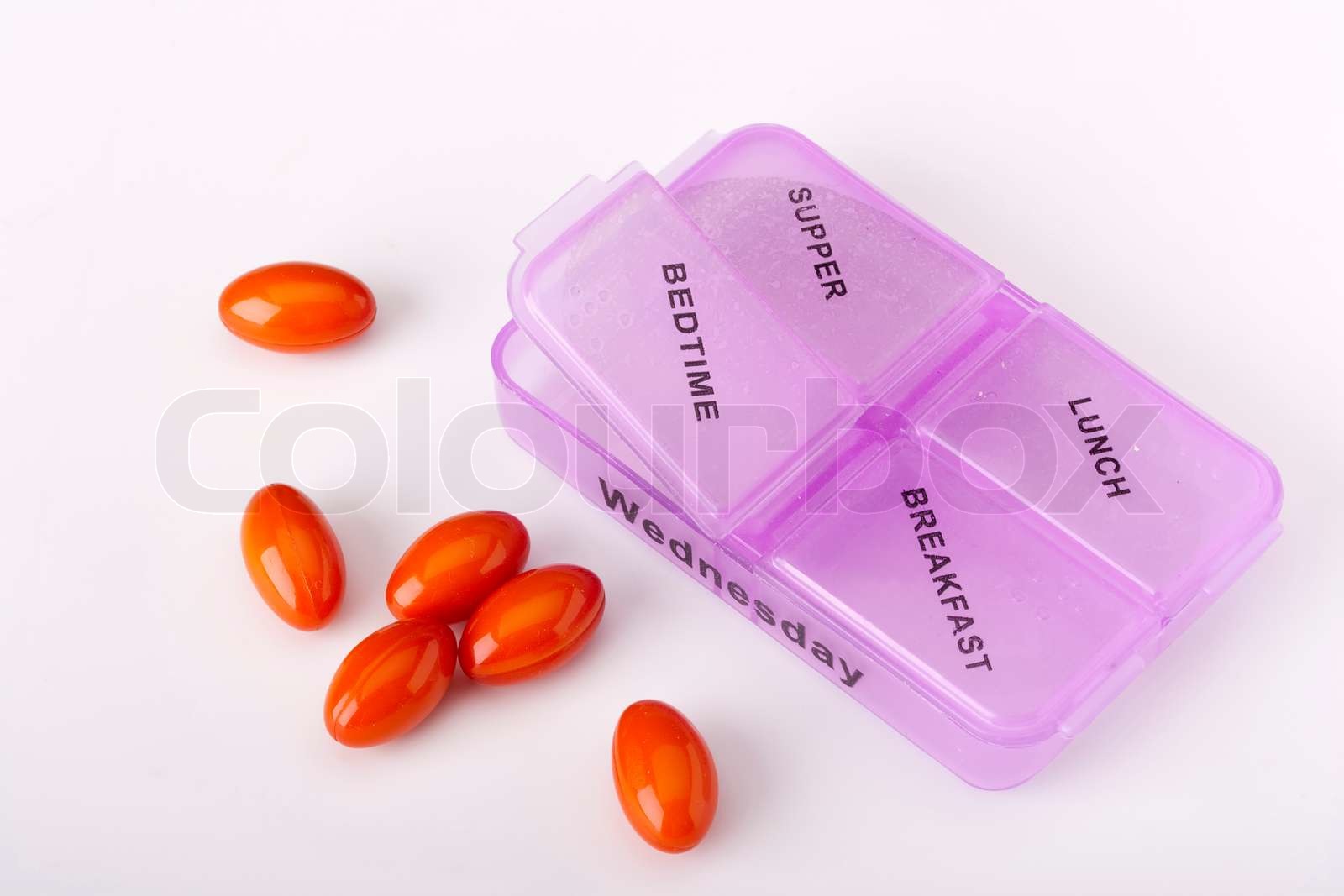 Box for medications showing days of the week. | Stock image | Colourbox