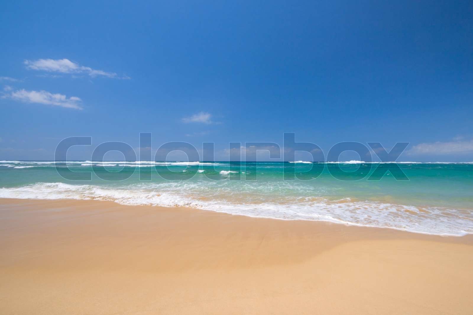 Peaceful beach scene with ocean and blue sky | Stock image | Colourbox