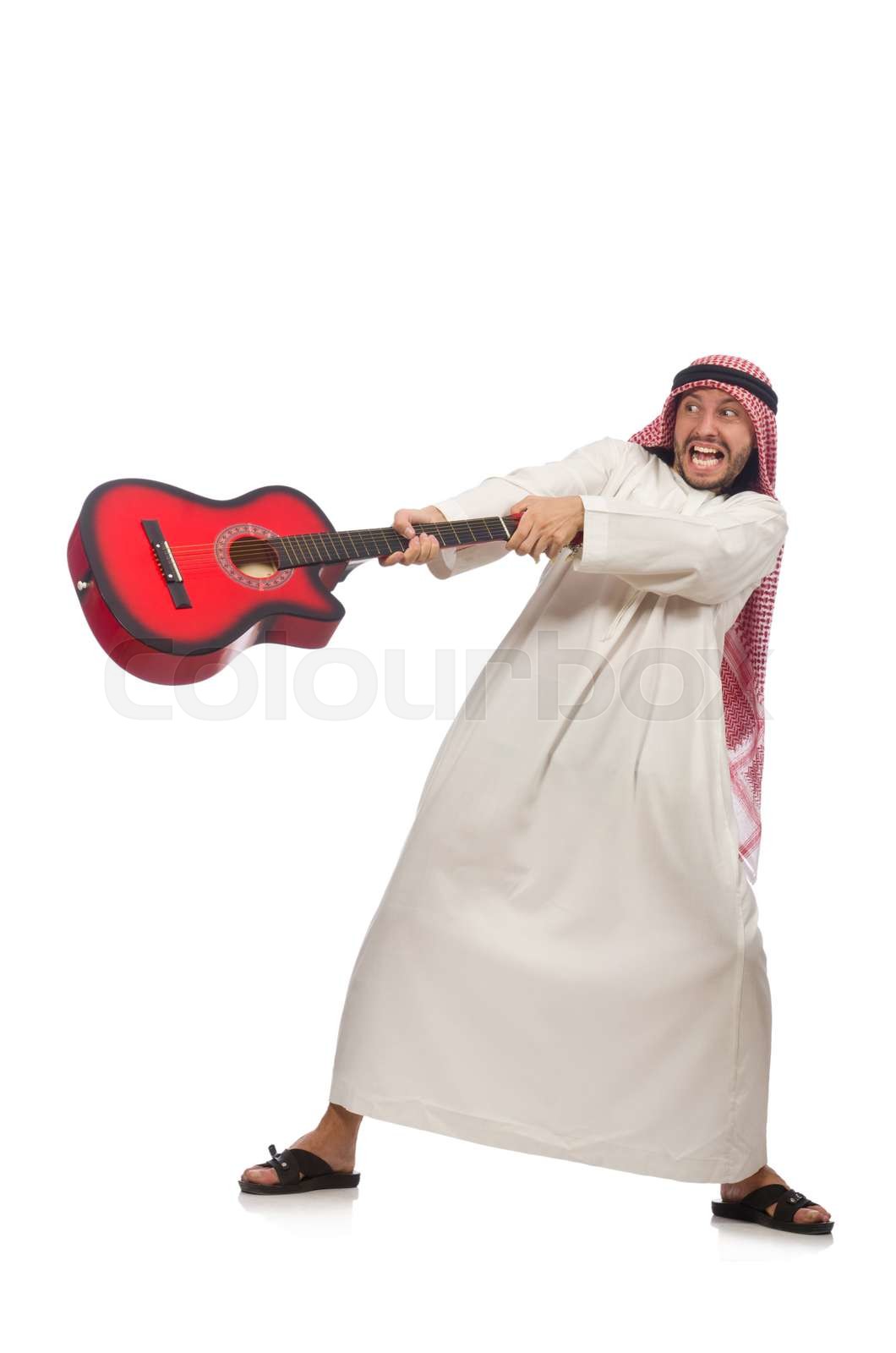 Arab man playing isolated on white | Stock image | Colourbox