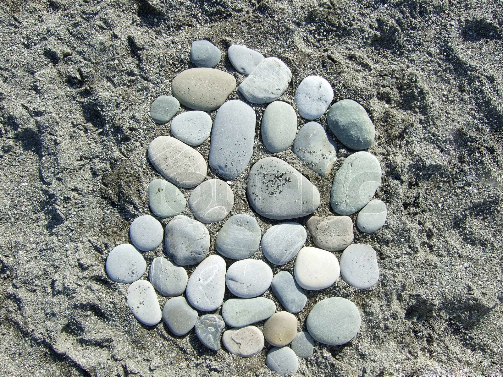 pebbles on a sand beach | Stock image | Colourbox
