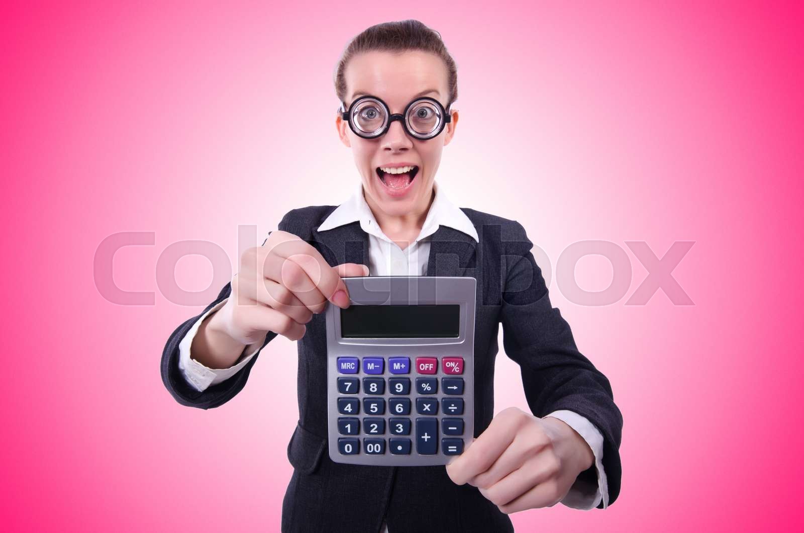 Nerd female accountant with calculator | Stock image | Colourbox