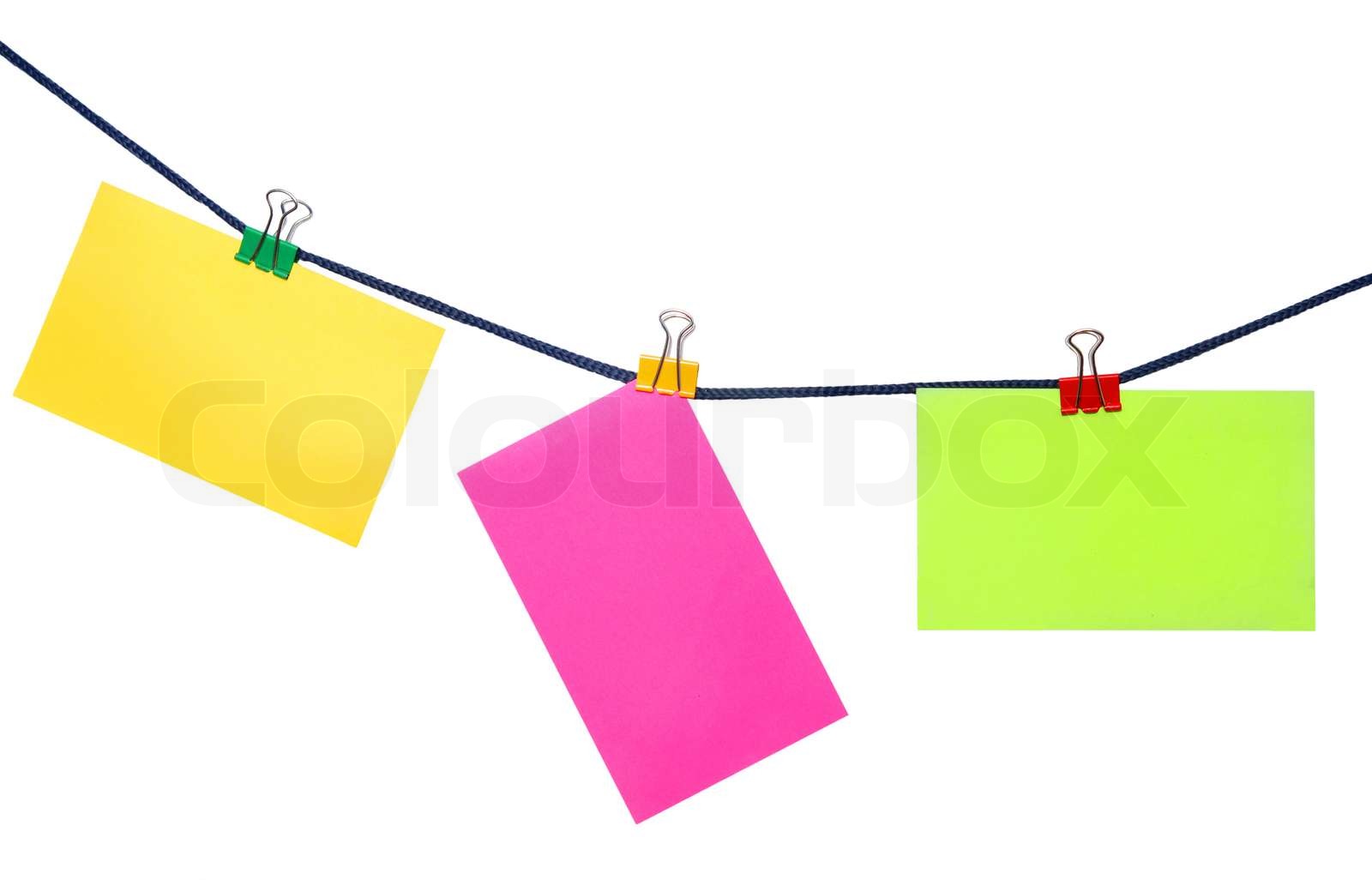 notes on a rope isolated on white | Stock image | Colourbox