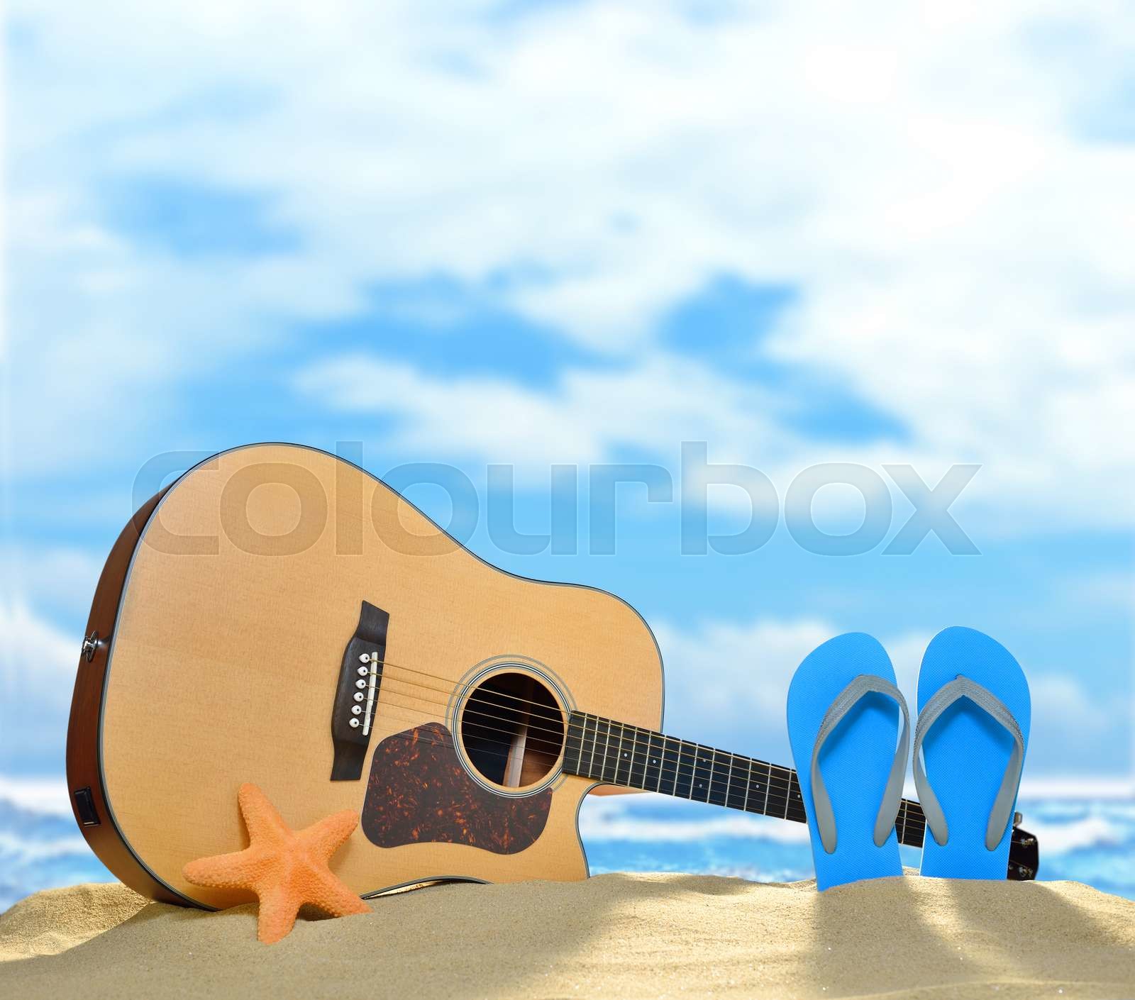 Acoustic guitar on the beach | Stock image | Colourbox