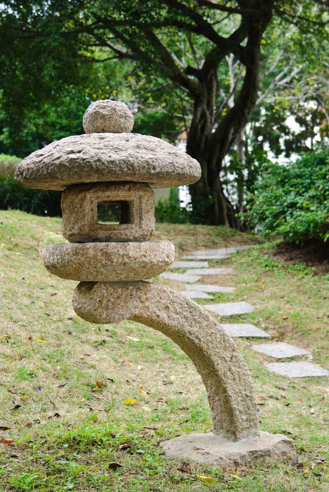 Japanese stone lantern in garden | Stock image | Colourbox