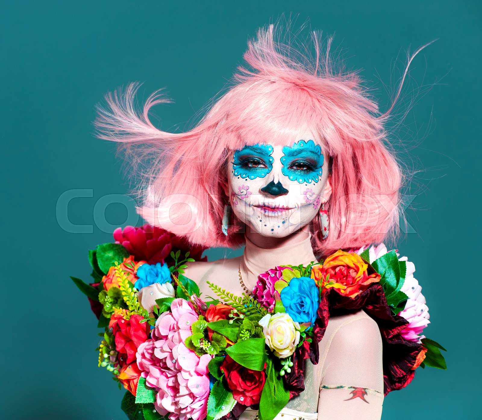 Undead zombie girl with skeleton mask on face and color flower suit ...