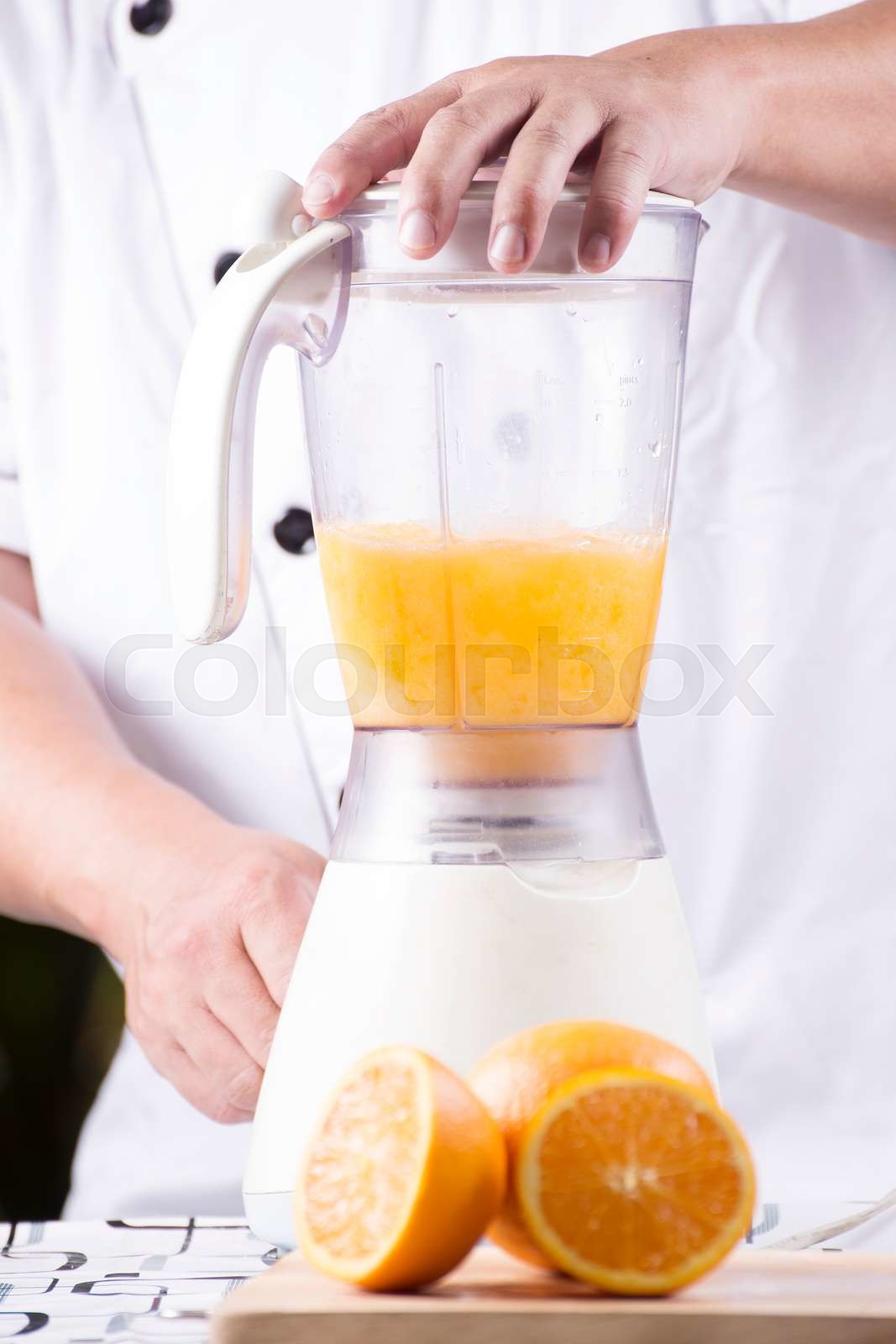 Chef making Orange juice smoothie | Stock image | Colourbox