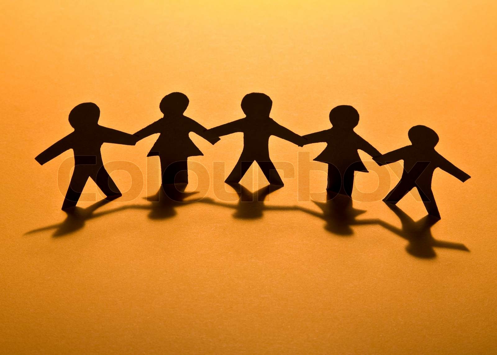 Teamwork on Orange Background. Business series. | Stock image | Colourbox