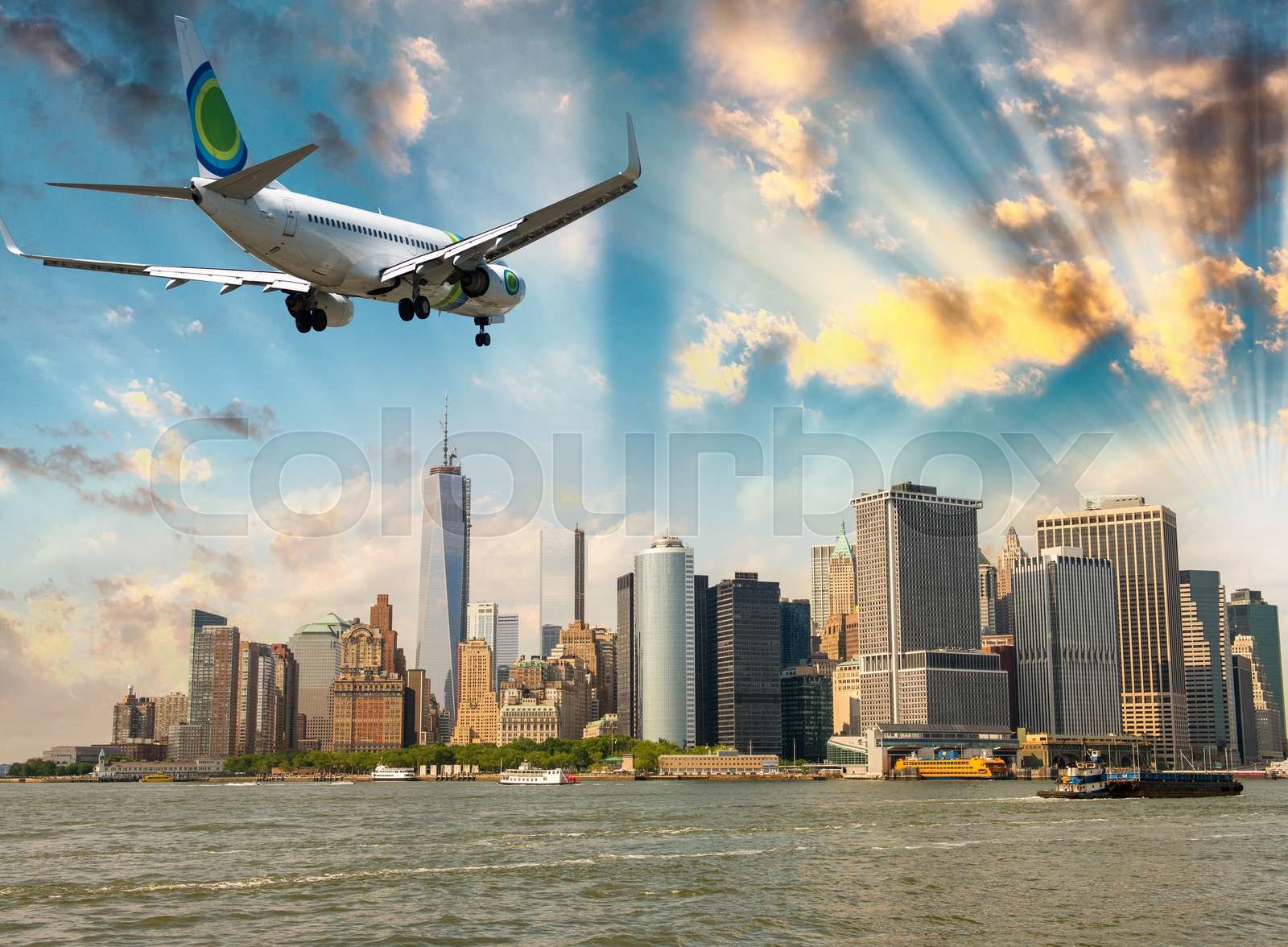Aircraft overflying New York City skyline | Stock image | Colourbox