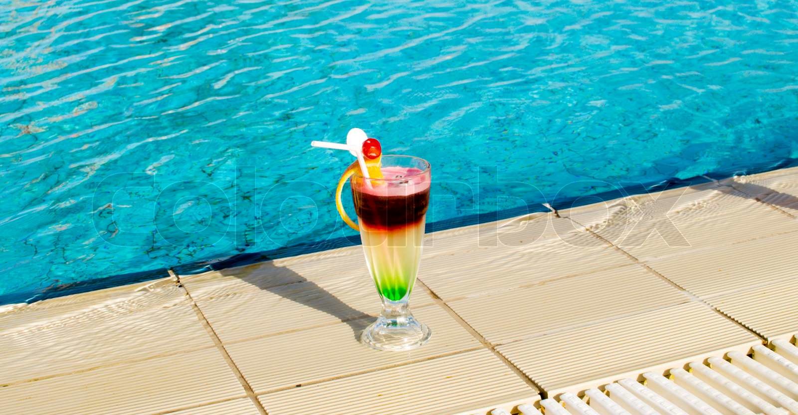 cocktail near swimming pool | Stock image | Colourbox