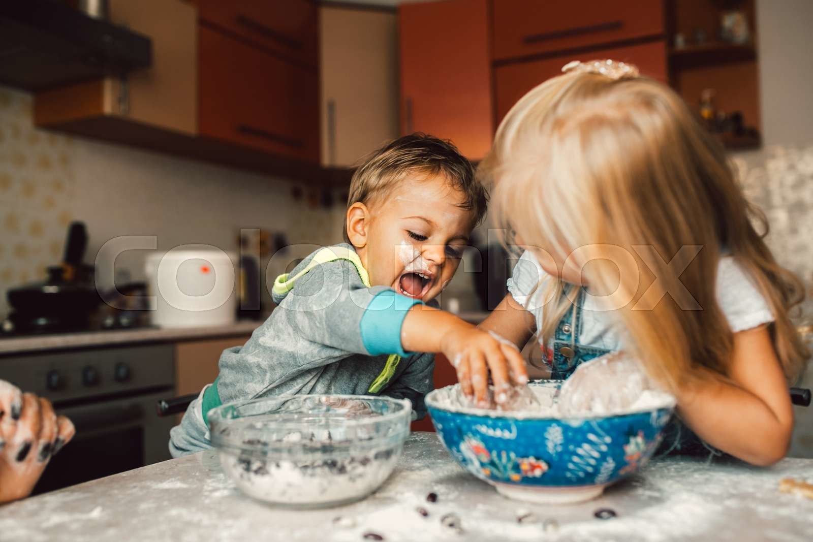 Kids is playing with flour | Stock image | Colourbox