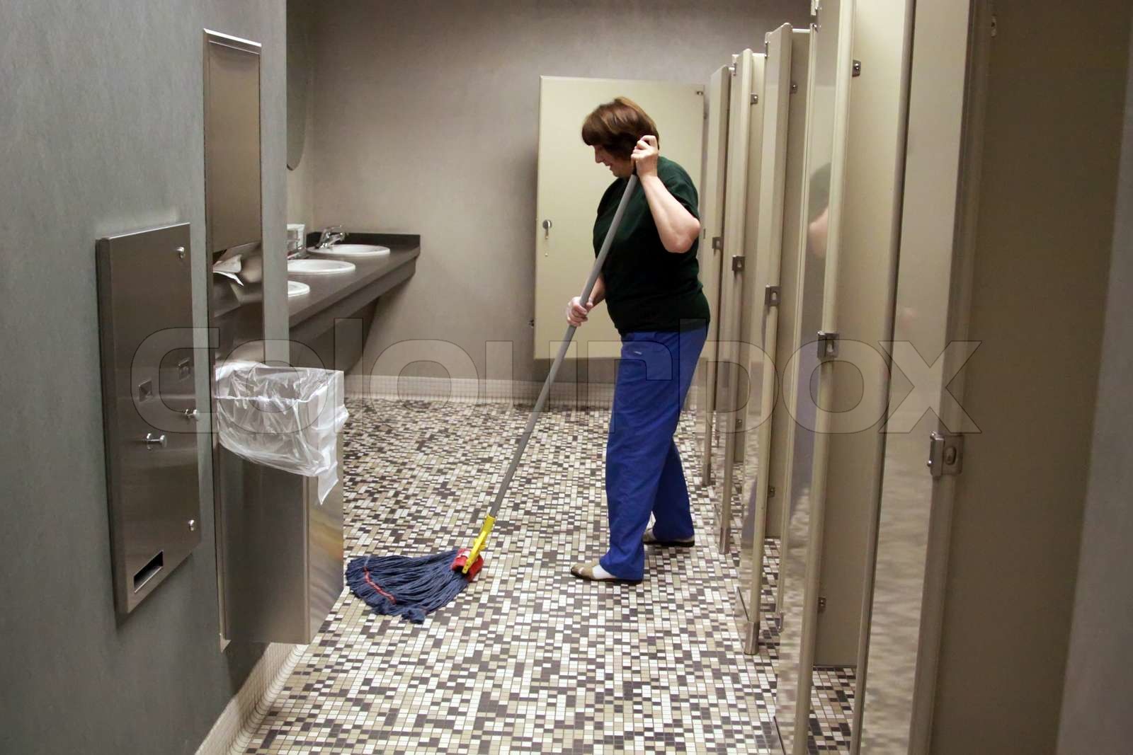 Toilet cleaning in a public building | Stock image | Colourbox