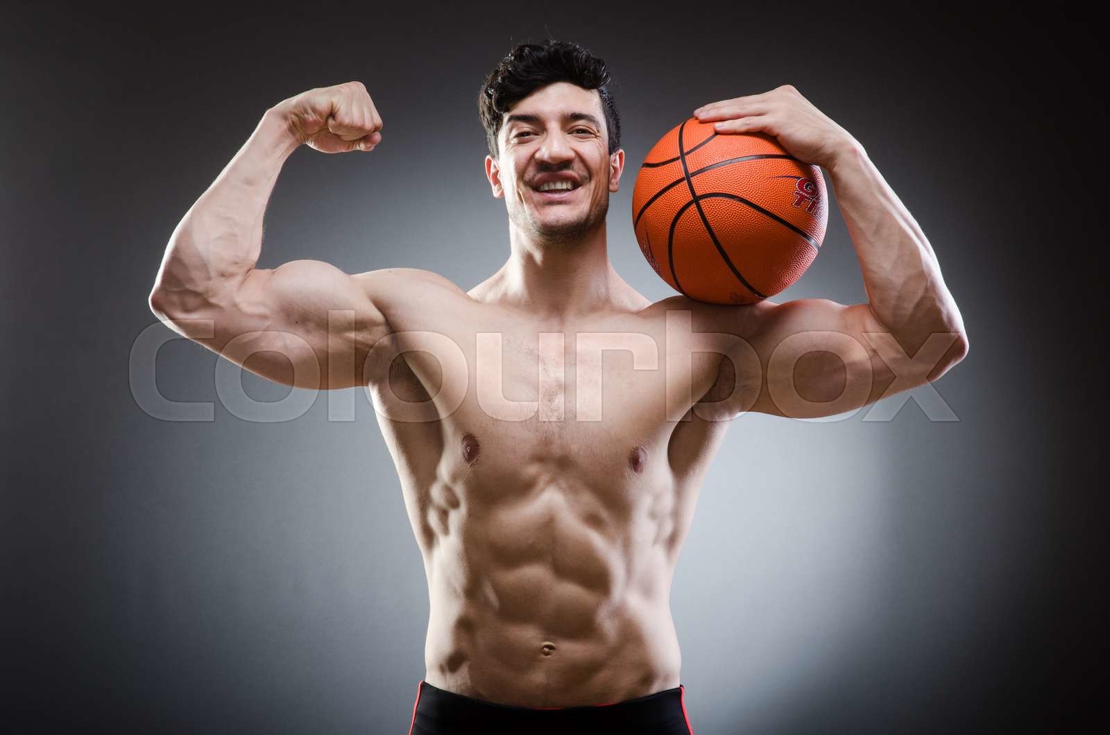 Muscular basketball in sports concept | Stock image | Colourbox
