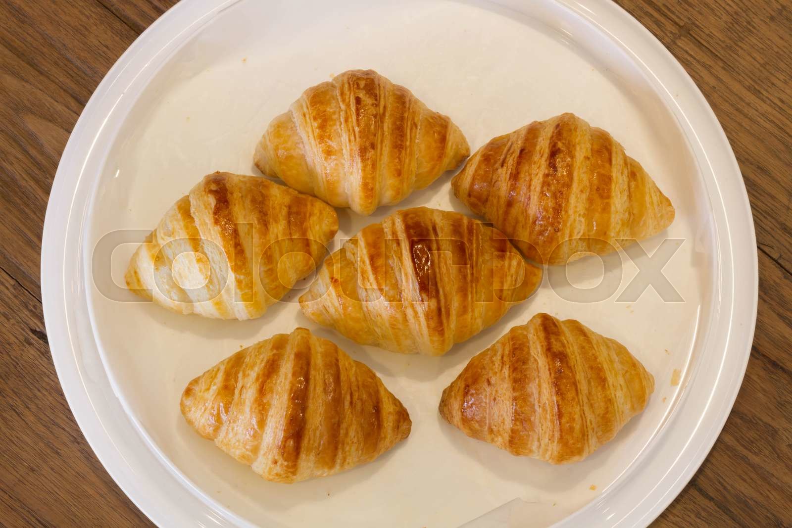 Six little croissant on the cycle tray | Stock image | Colourbox