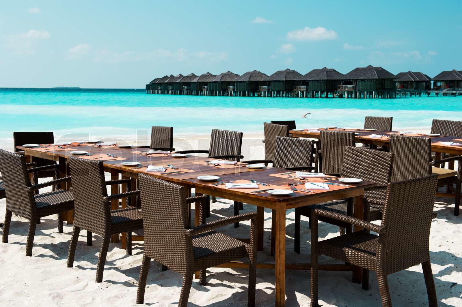 Table and chairs on exotic beach | Stock image | Colourbox