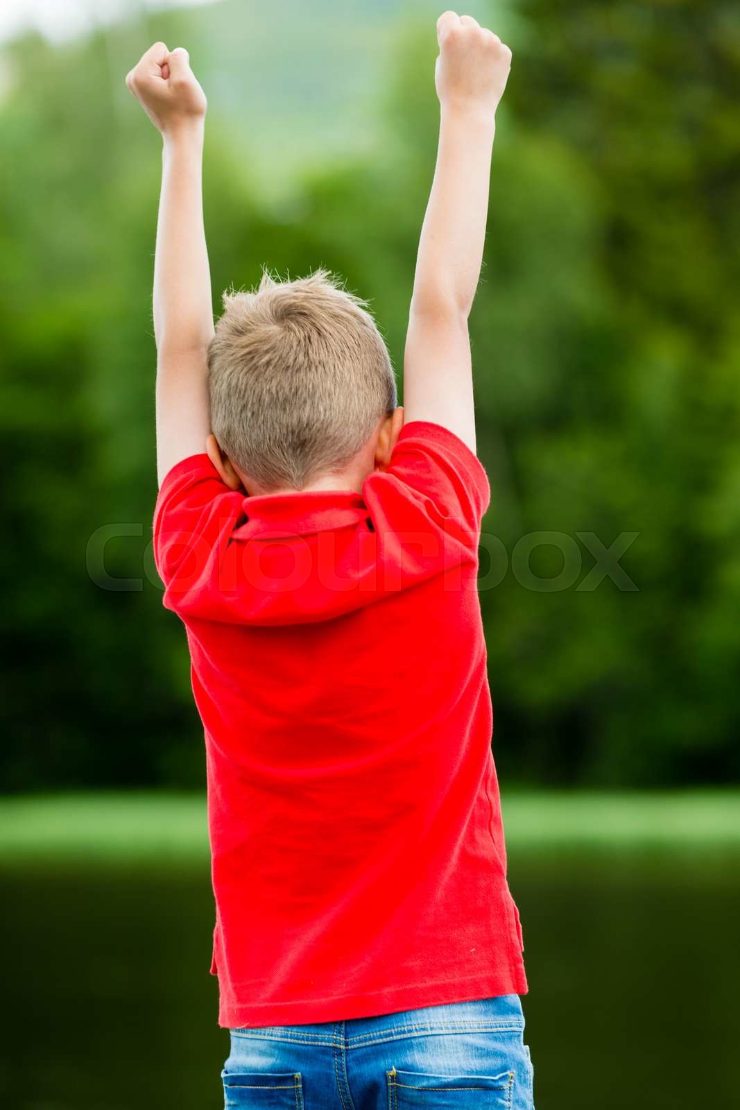Boy with raised arms | Stock image | Colourbox