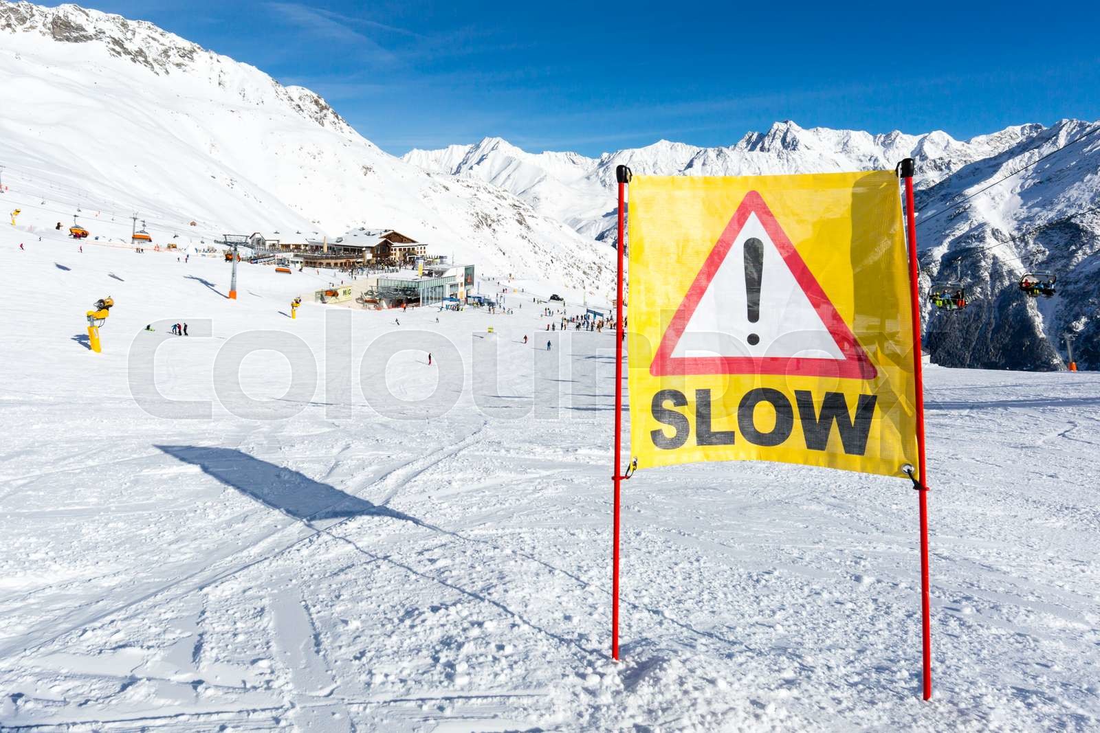 Yellow slow down warning sign | Stock image | Colourbox
