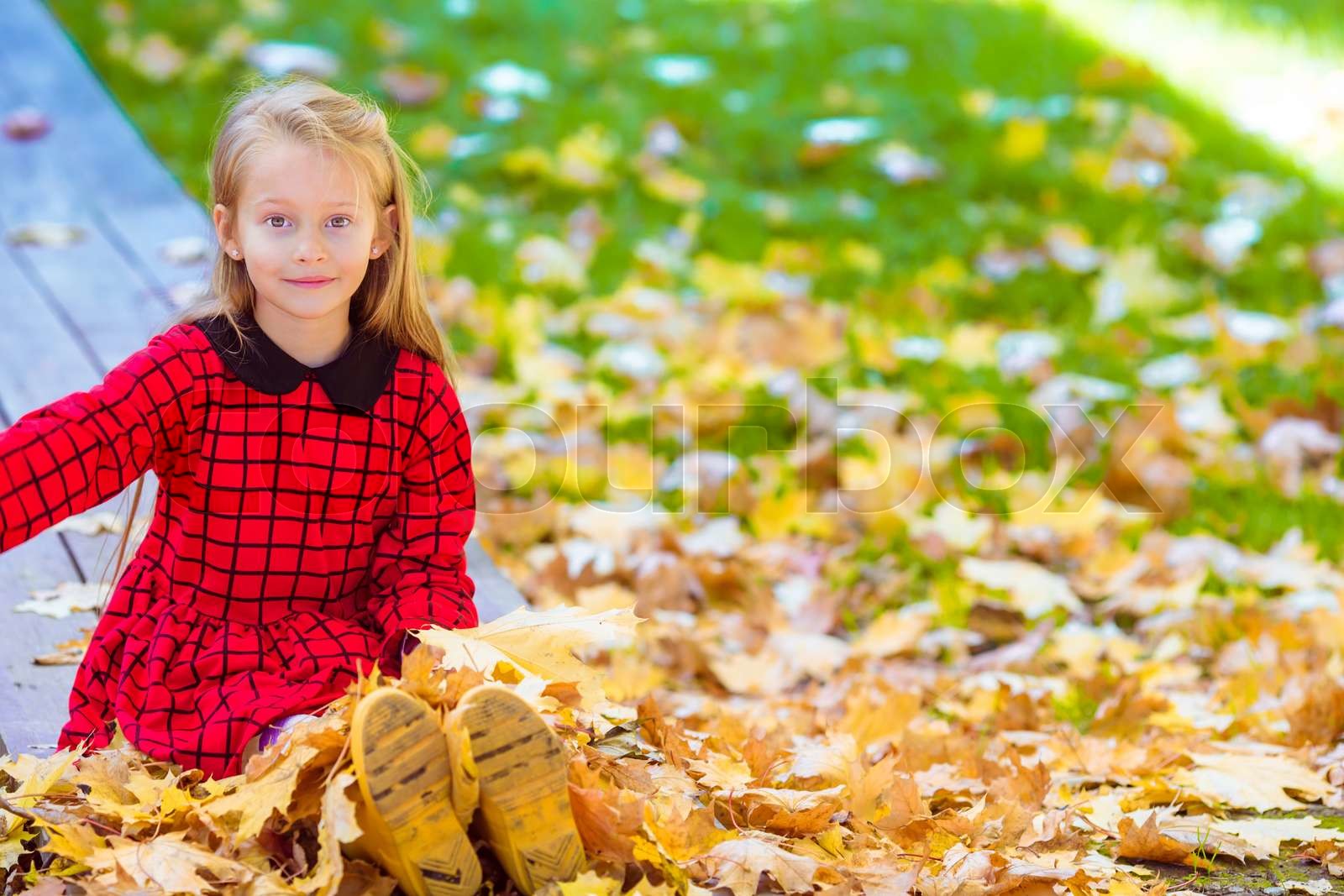Adorable little girl have fun outdoors at beautiful autumn day | Stock ... Adorable little girl have fun outdoors at beautiful autumn day | Stock ...