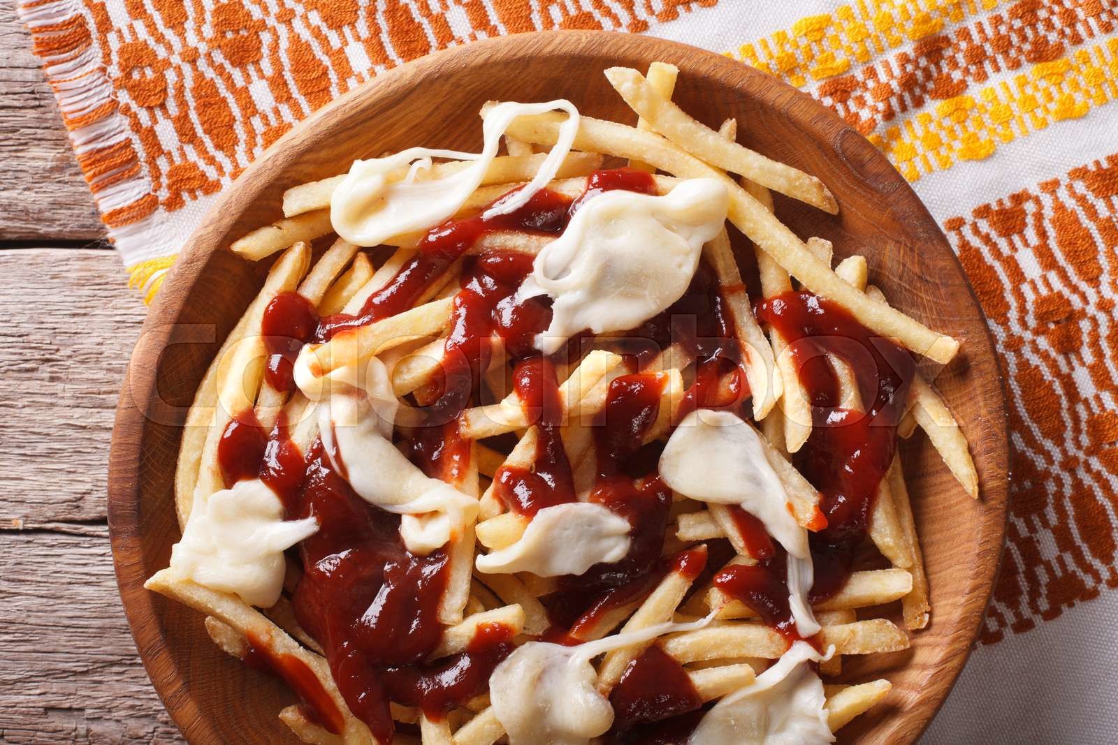 poutine - french fries with gravy and cheese. Horizontal top view ...