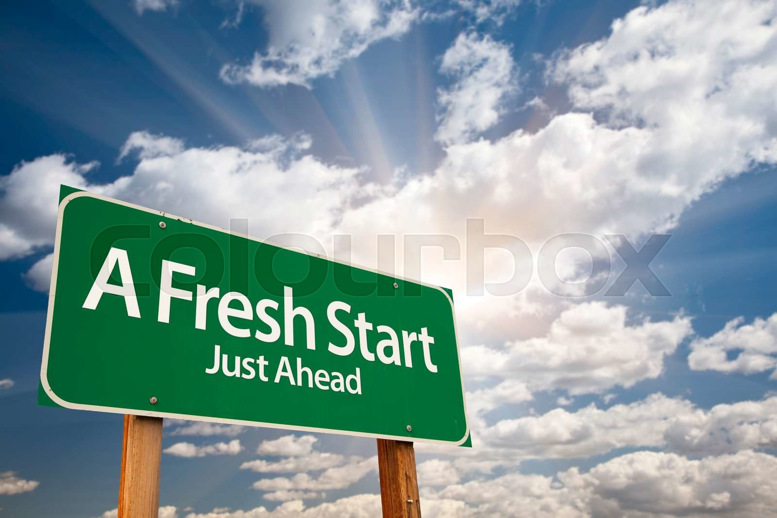 A Fresh Start Green Road Sign Over Clouds | Stock image | Colourbox