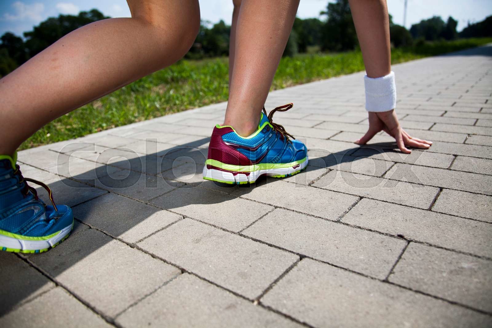 Runner feet running on road closeup on shoe | Stock image | Colourbox