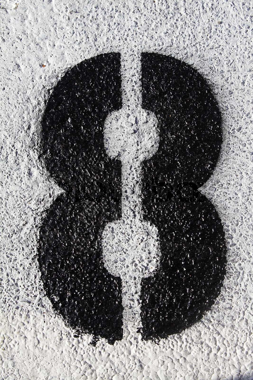 Black number eight painted on the asphalt | Stock image | Colourbox