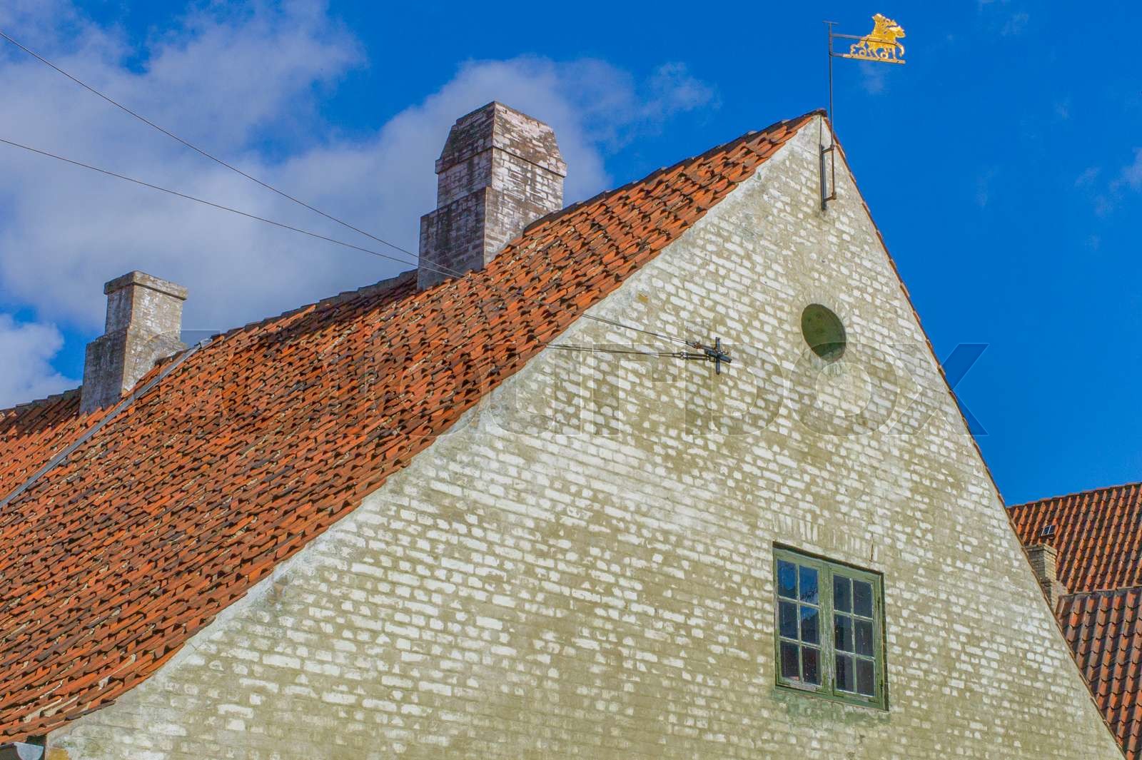 Husgavl på typisk dansk hus med vejrhane | Stock foto | Colourbox