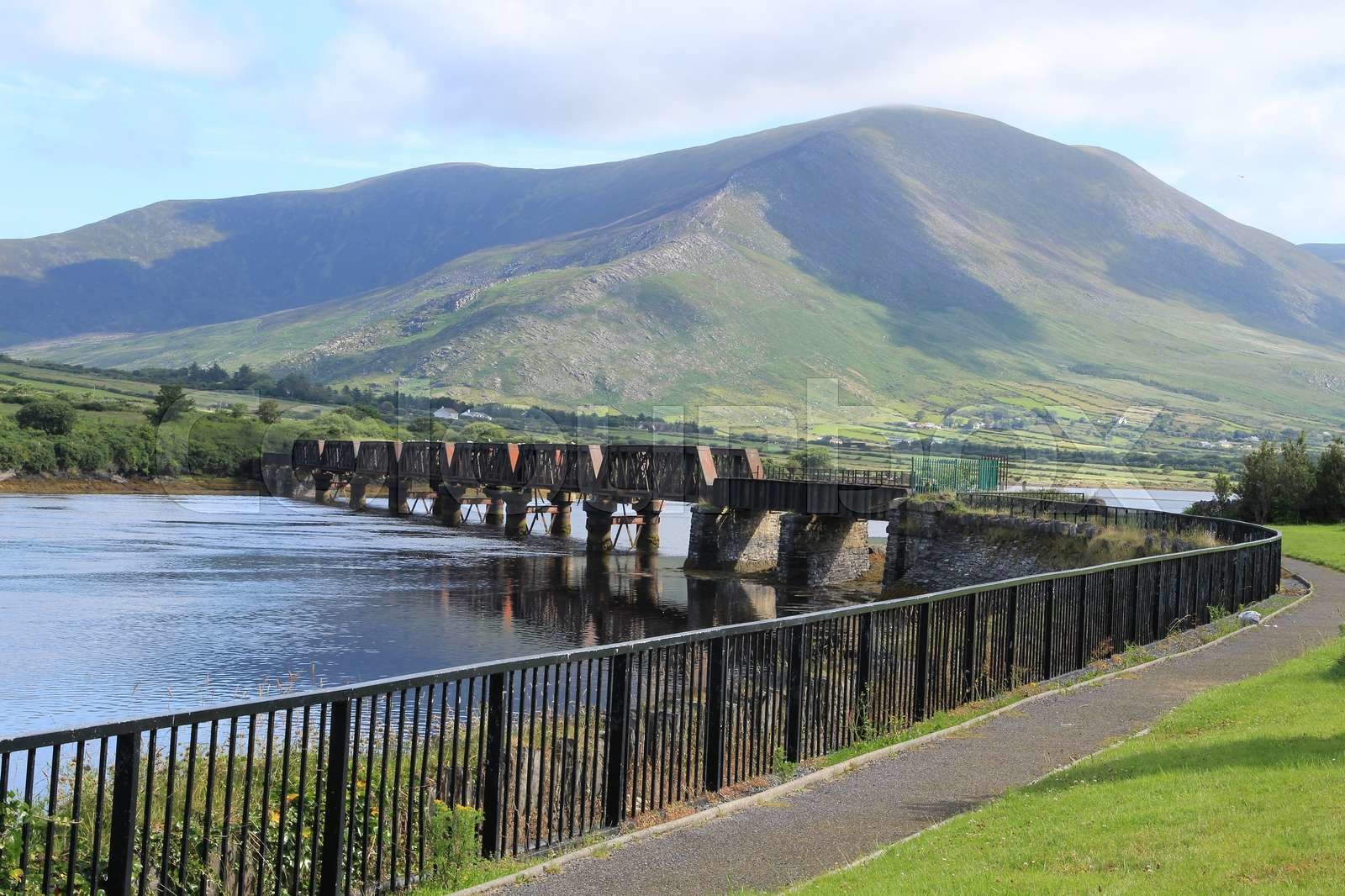 The river, black fence, closed bridge Railway Viaduct, and the ...