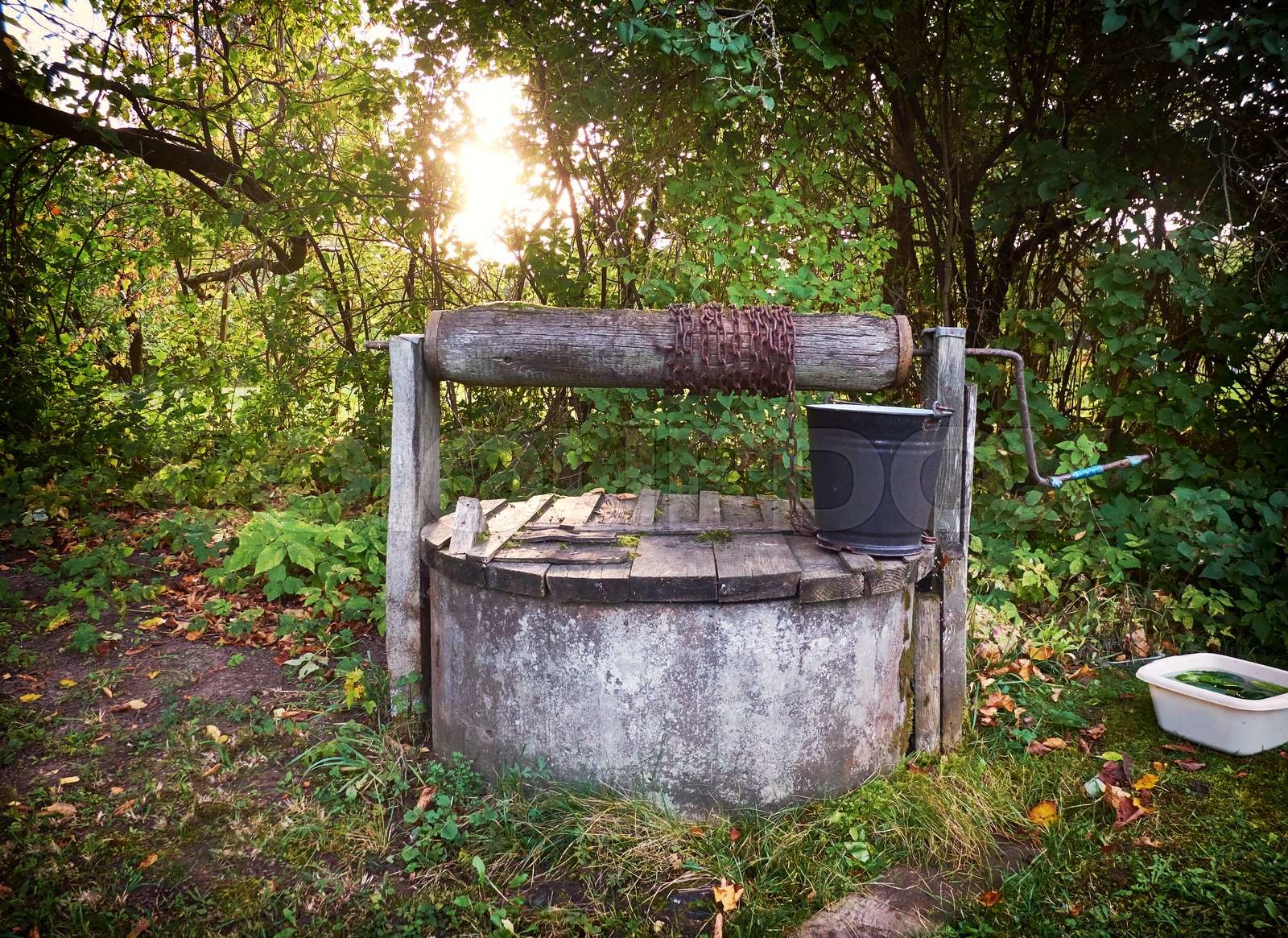 Rural well with bucket | Stock image | Colourbox