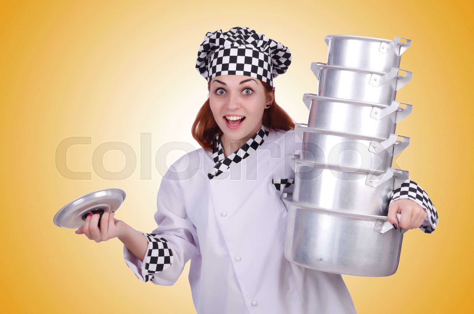 Cook with stack of pots on white | Stock image | Colourbox