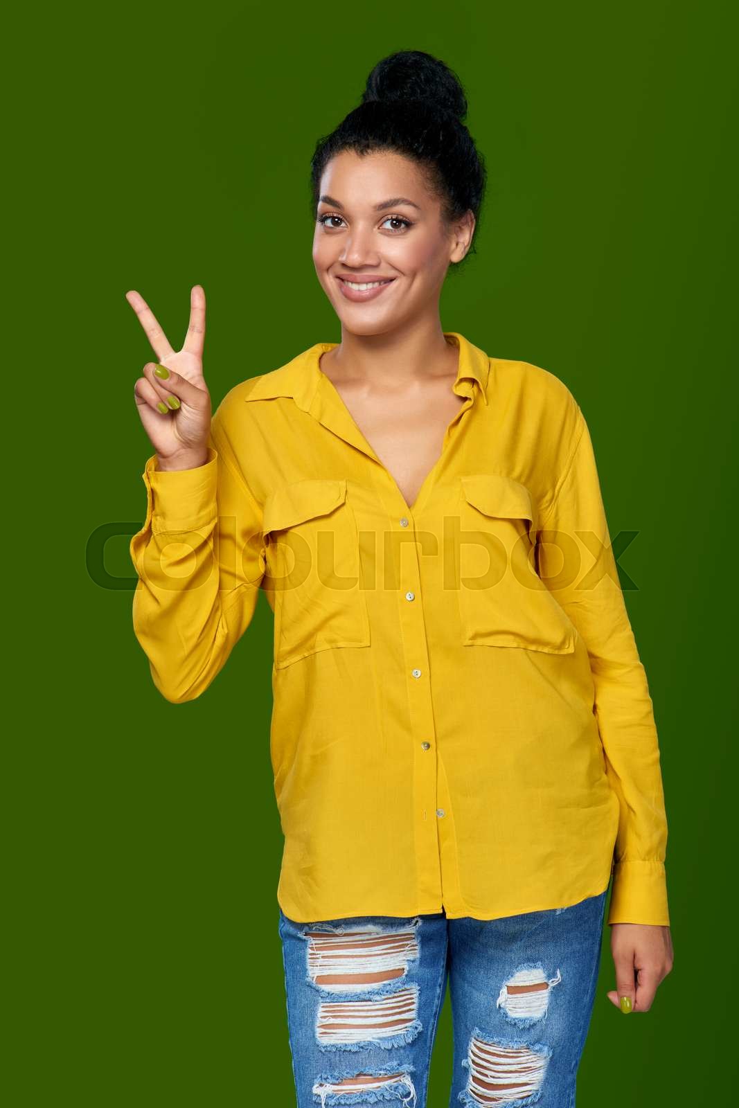 Woman showing one finger | Stock image | Colourbox