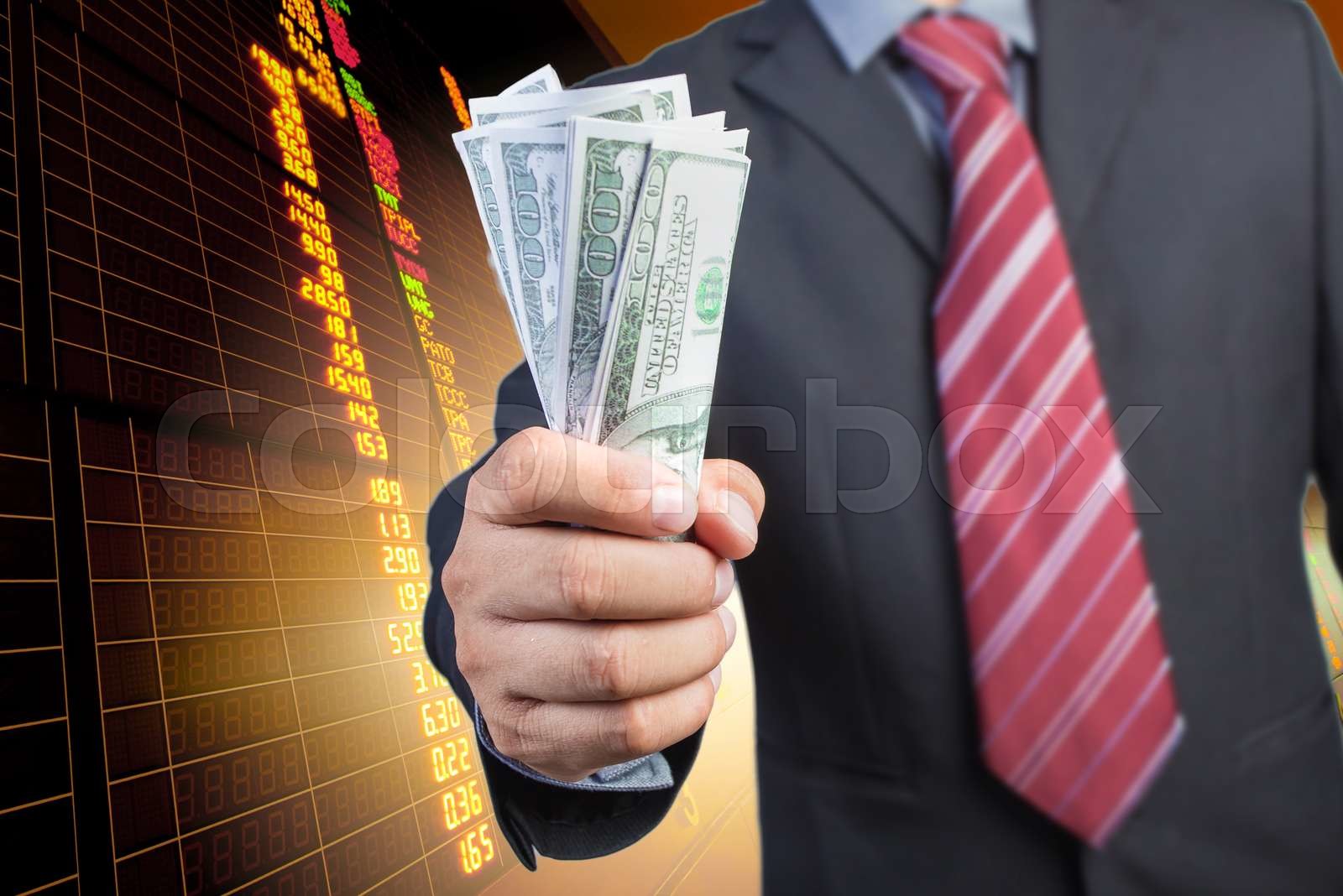 Businessman hand gripping money, US dollar (USD) bills - investment ...