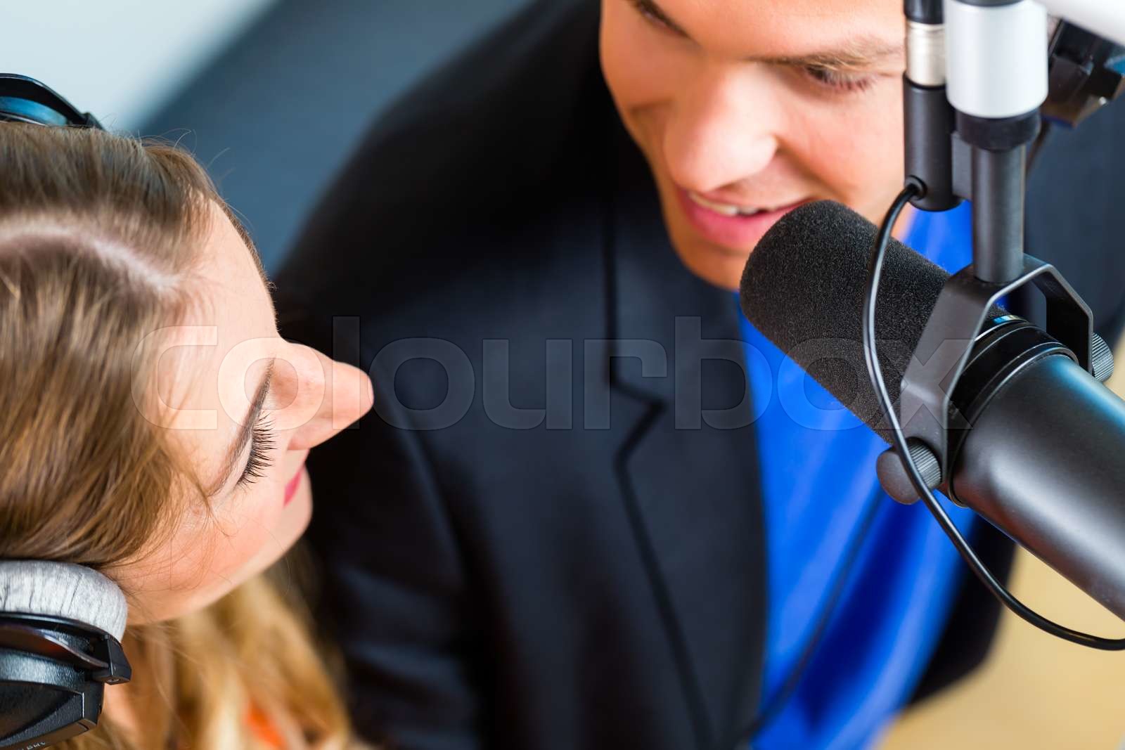 radio presenters in radio station on air | Stock image | Colourbox