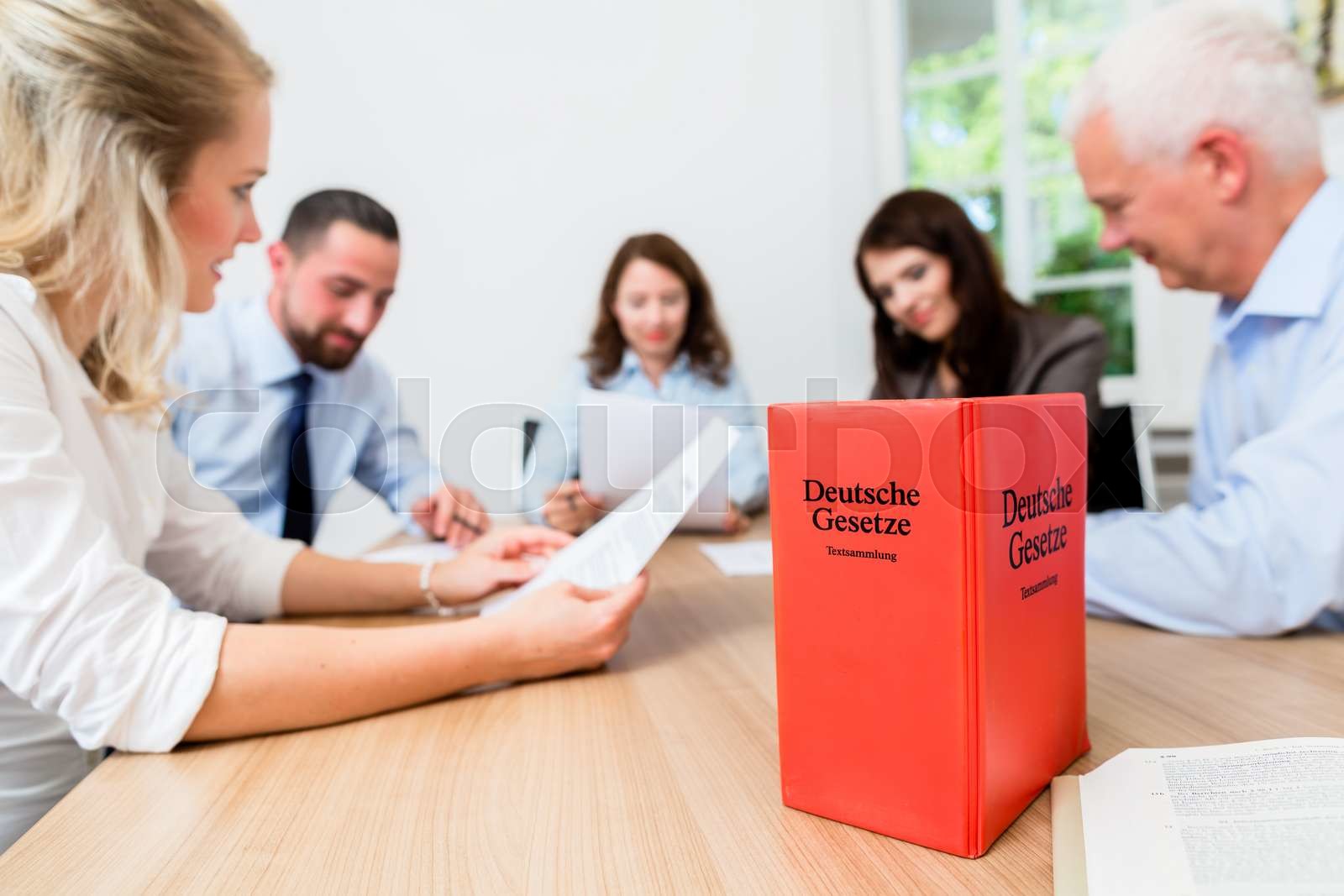 Lawyers in meeting negotiating agreement | Stock image | Colourbox