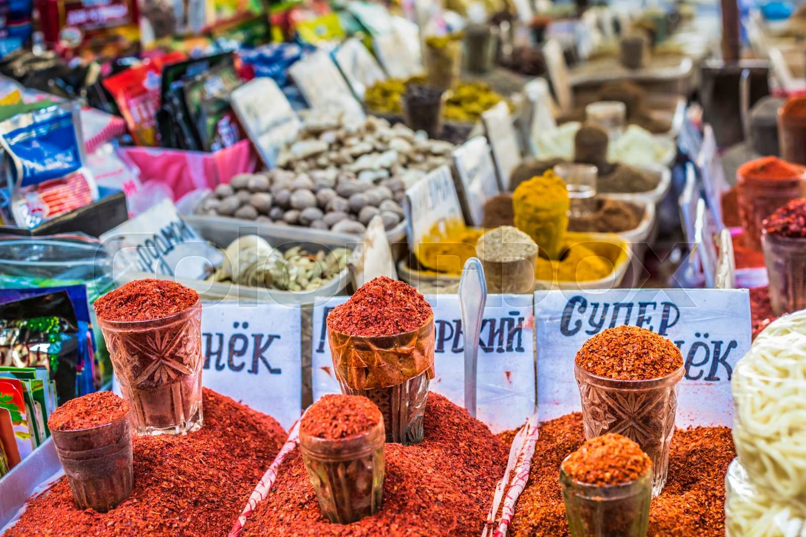 Vivid oriental central asian market with bags full of various spices in ...
