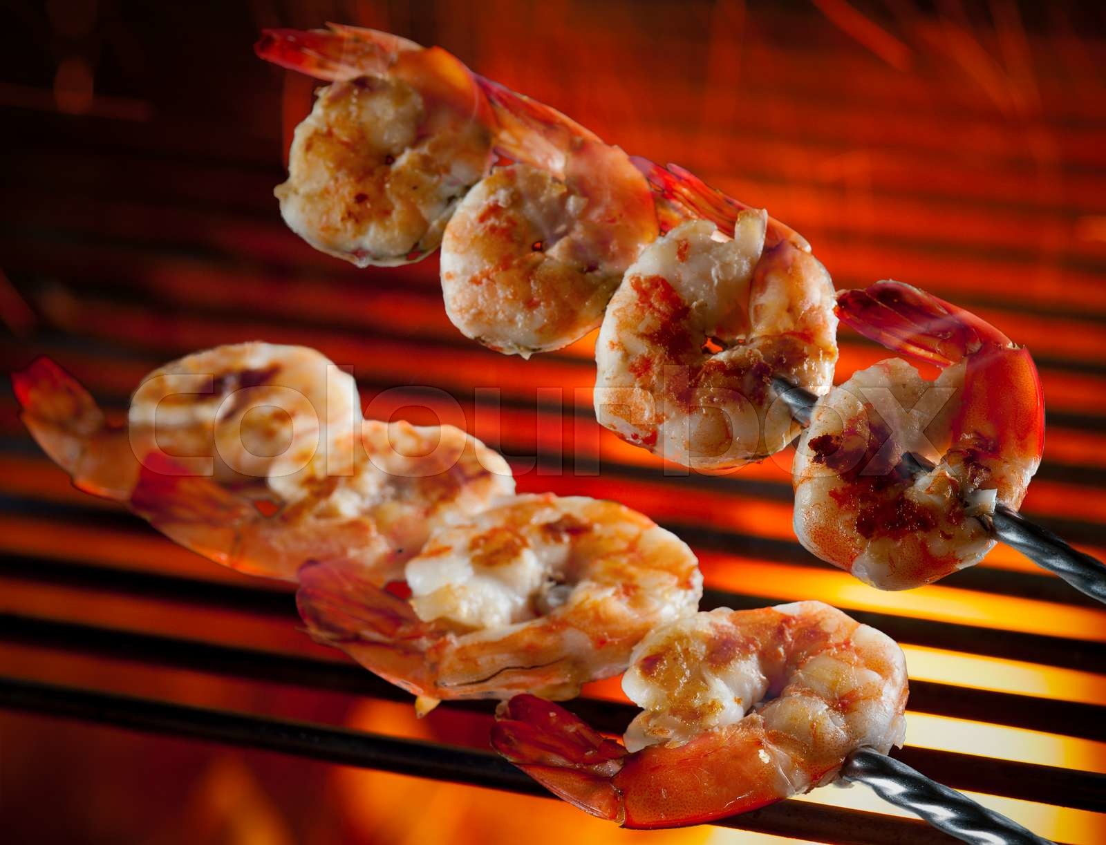 shrimp on the flaming grill ready to eat. | Stock image | Colourbox
