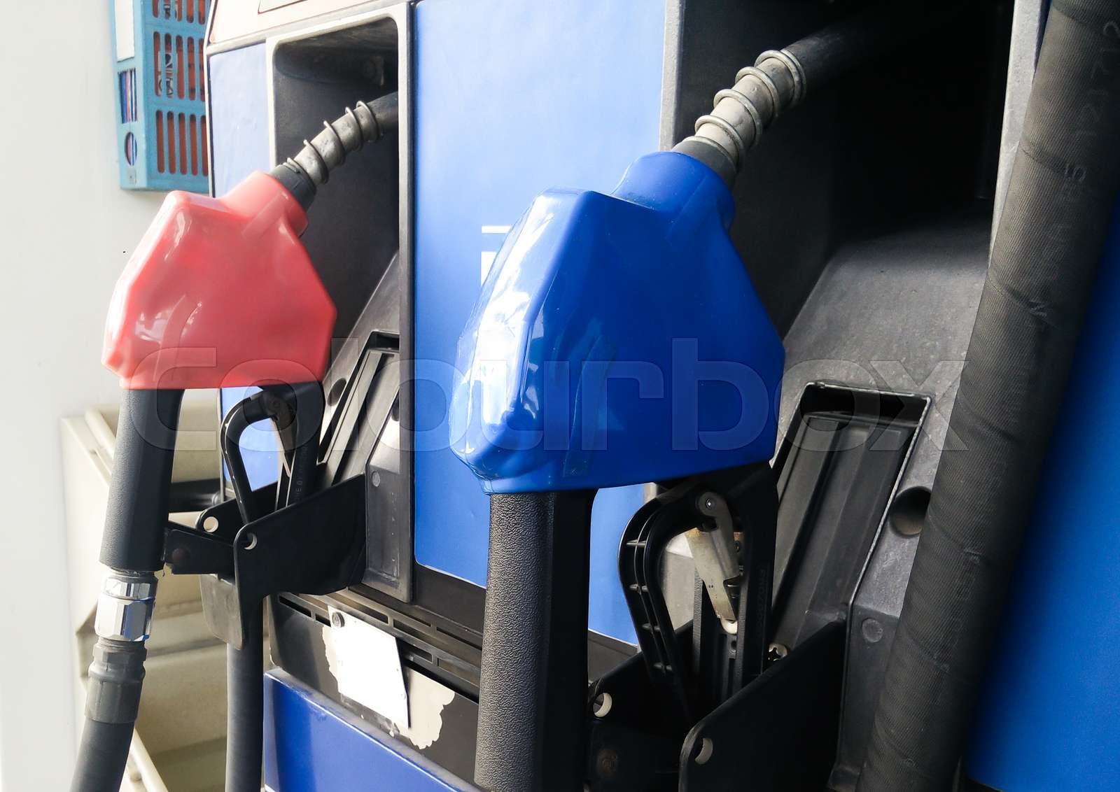 Fuel dispenser at petrol filling station | Stock image | Colourbox