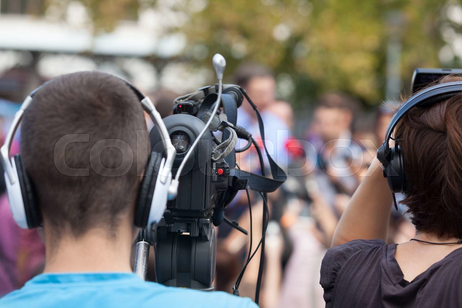 News conference. Cameraman. Video camera. | Stock image | Colourbox