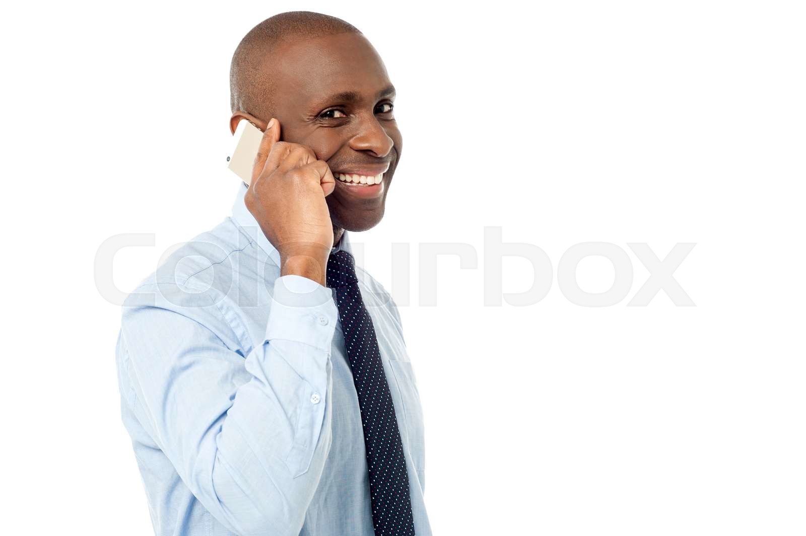 Male executive busy on phone call | Stock image | Colourbox