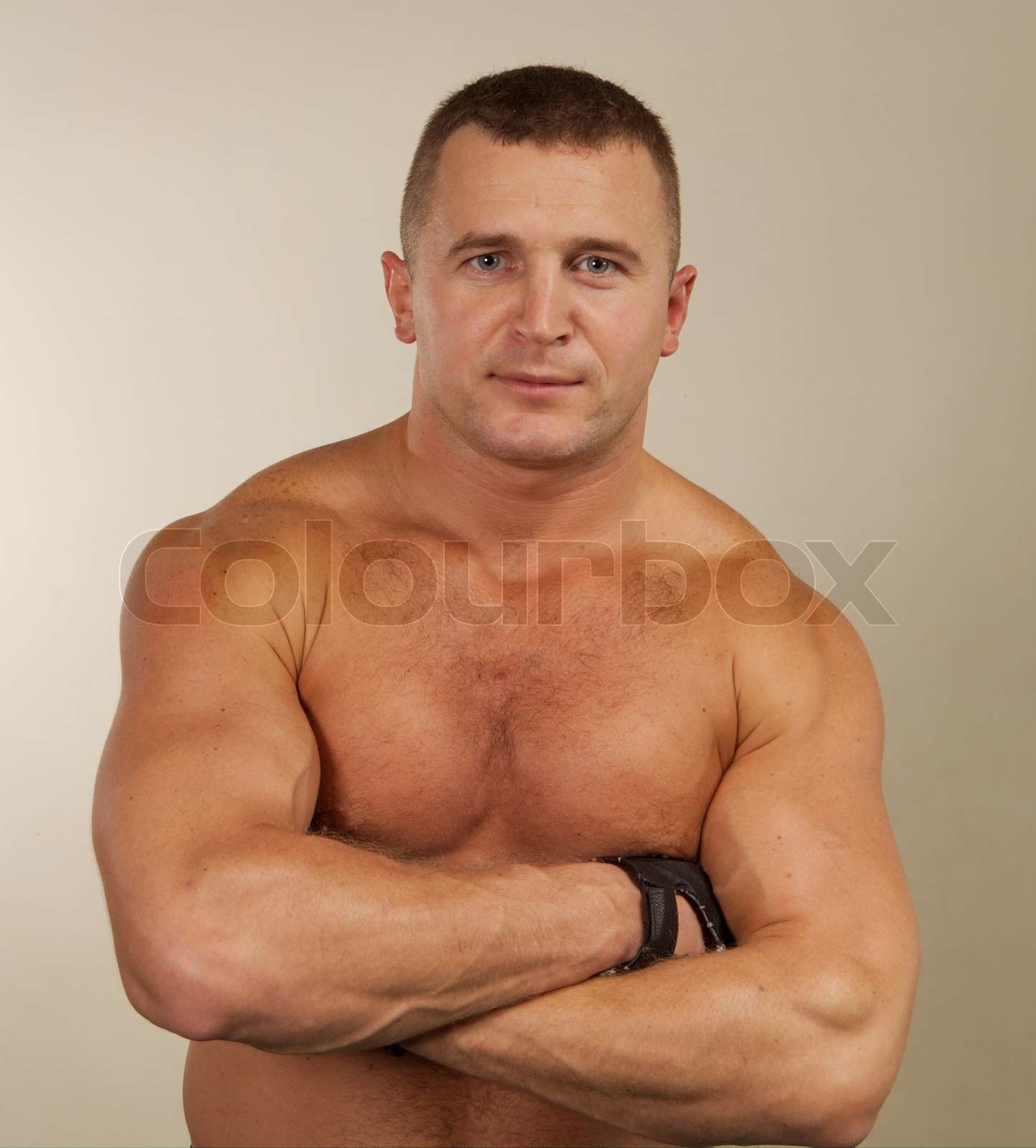Man shows the muscles | Stock image | Colourbox