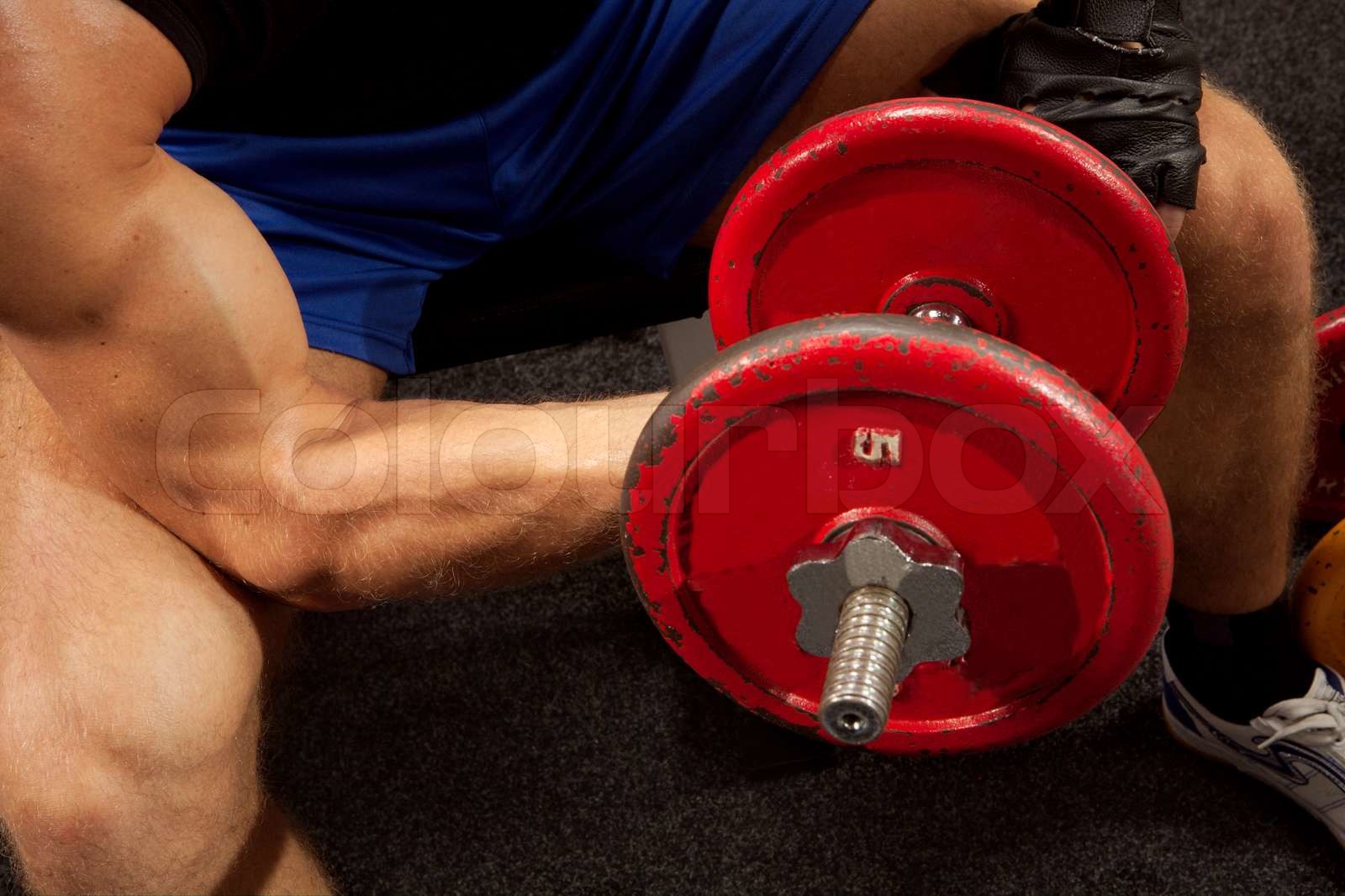 Man makes exercises for increase in force of muscles. | Stock image ...