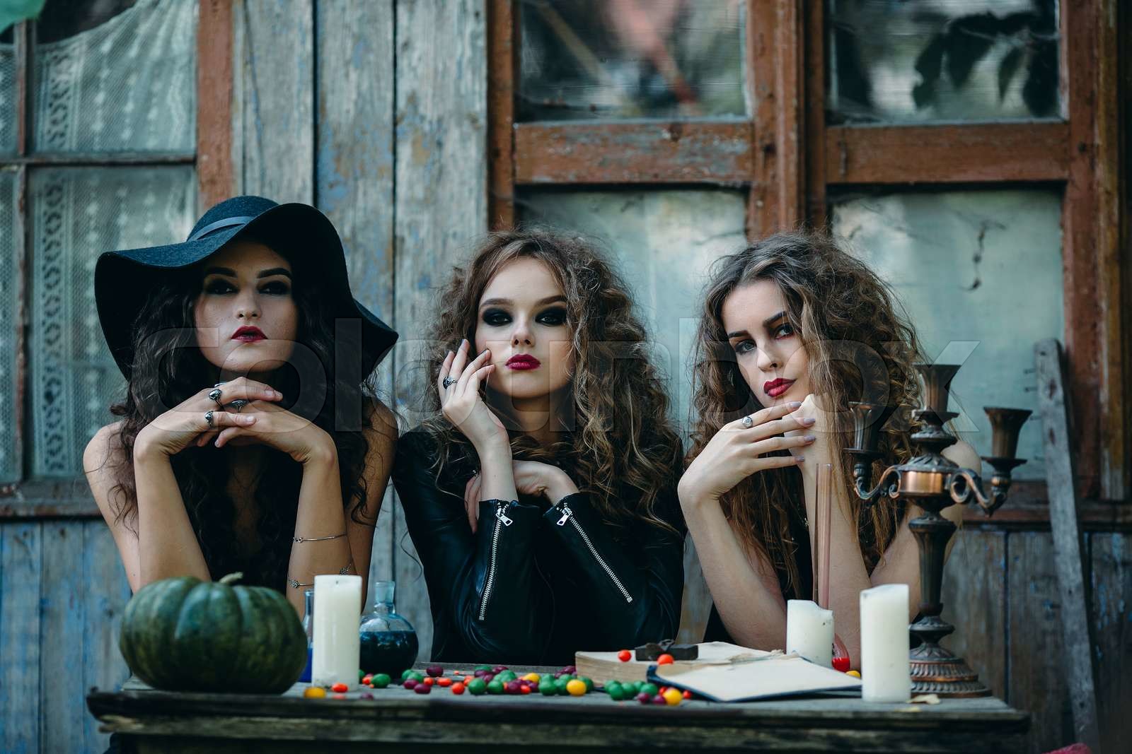 three witches at the table | Stock image | Colourbox