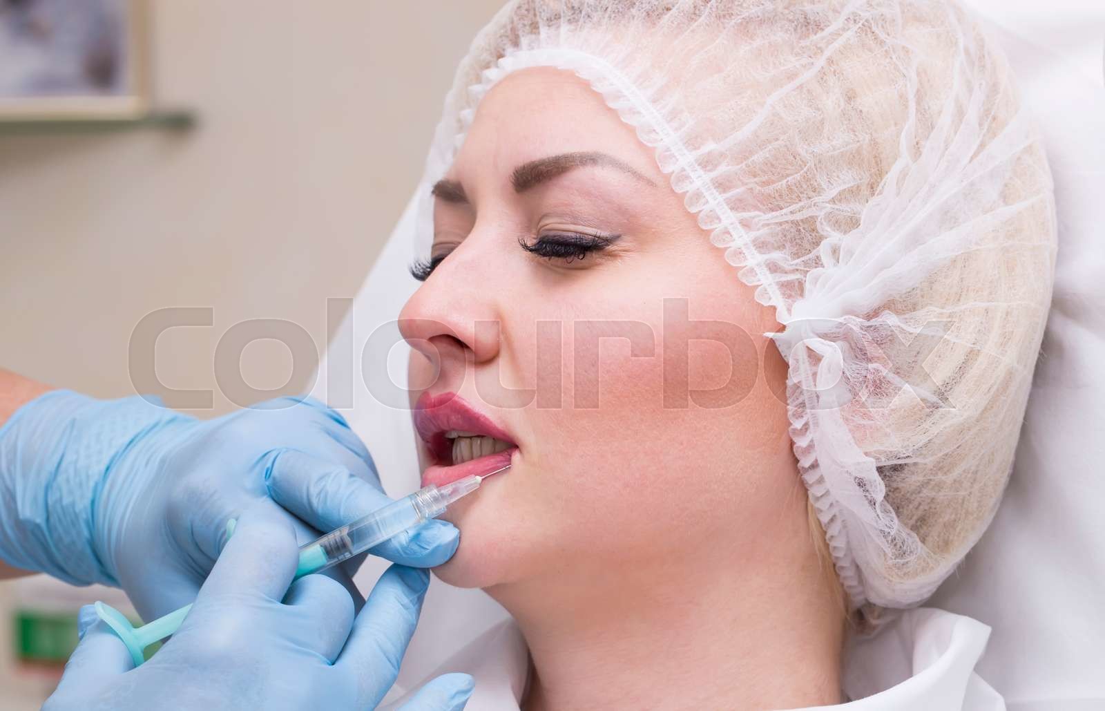 Cosmetic treatment with injection in a clinic | Stock image | Colourbox