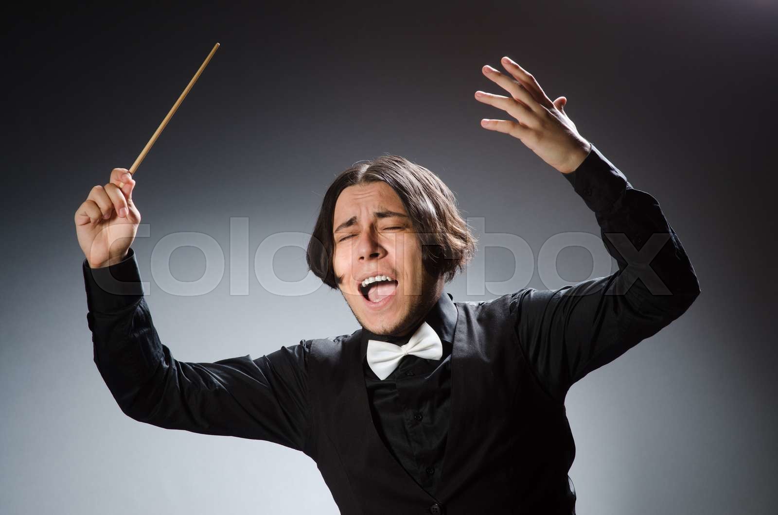 Funny conductor in musical concept | Stock image | Colourbox