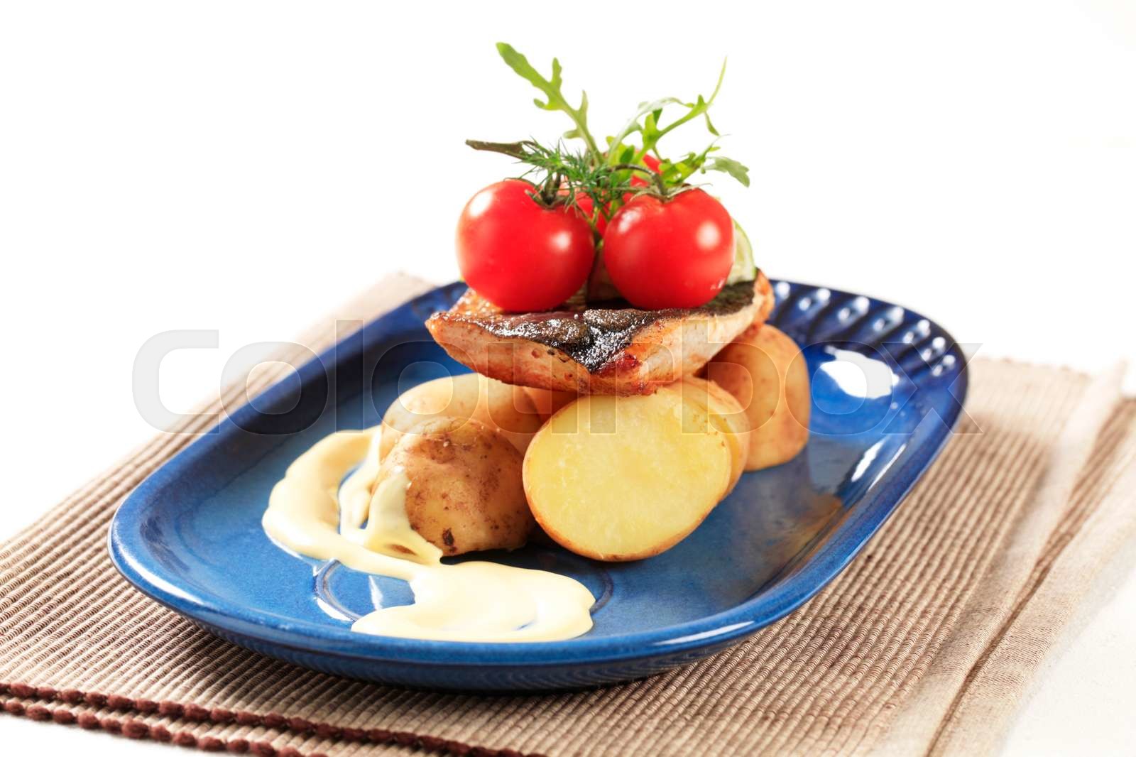 Pan fried fish with new potatoes | Stock image | Colourbox