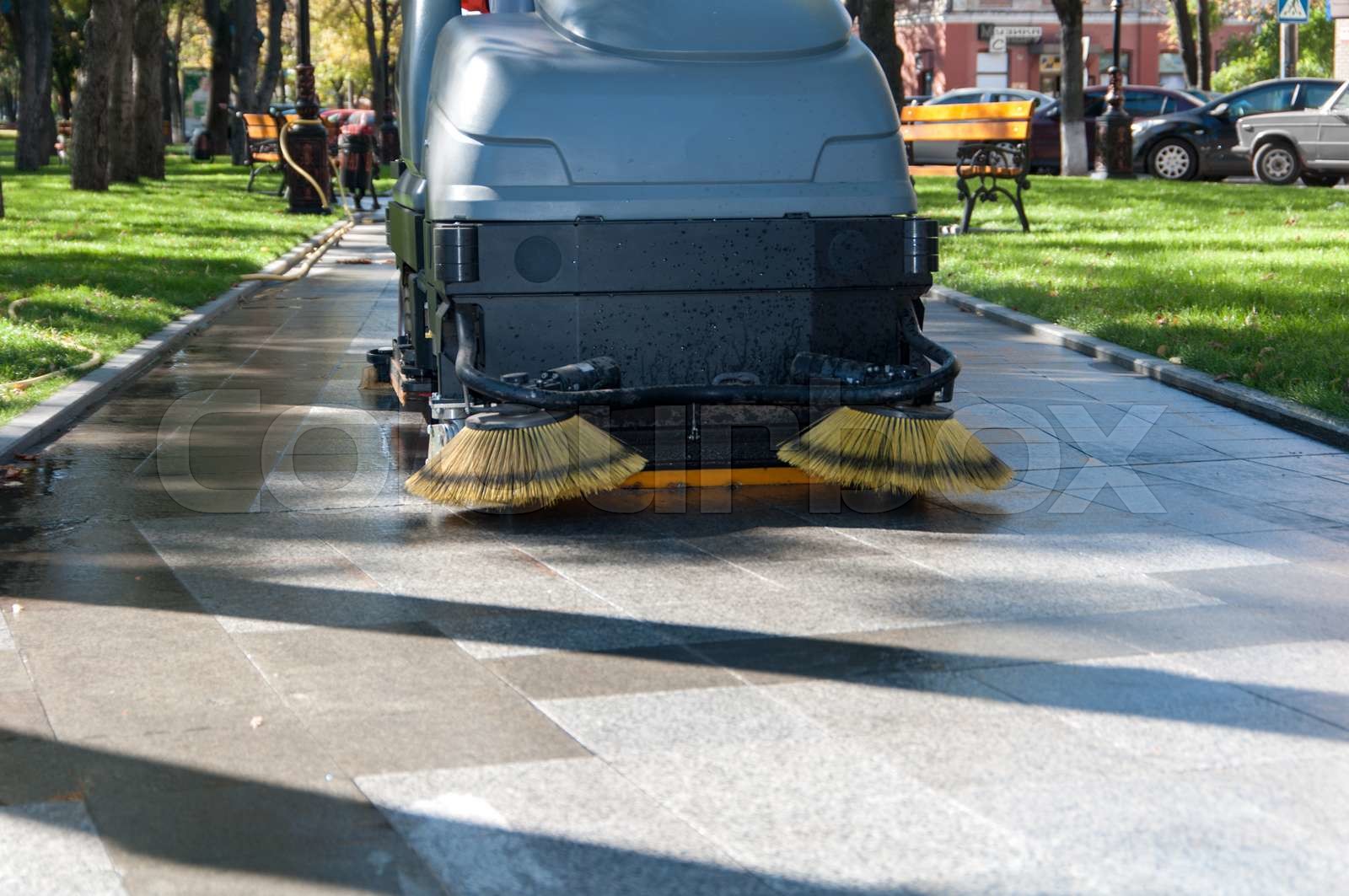 process of cleaning walkways in the Park machine | Stock image | Colourbox