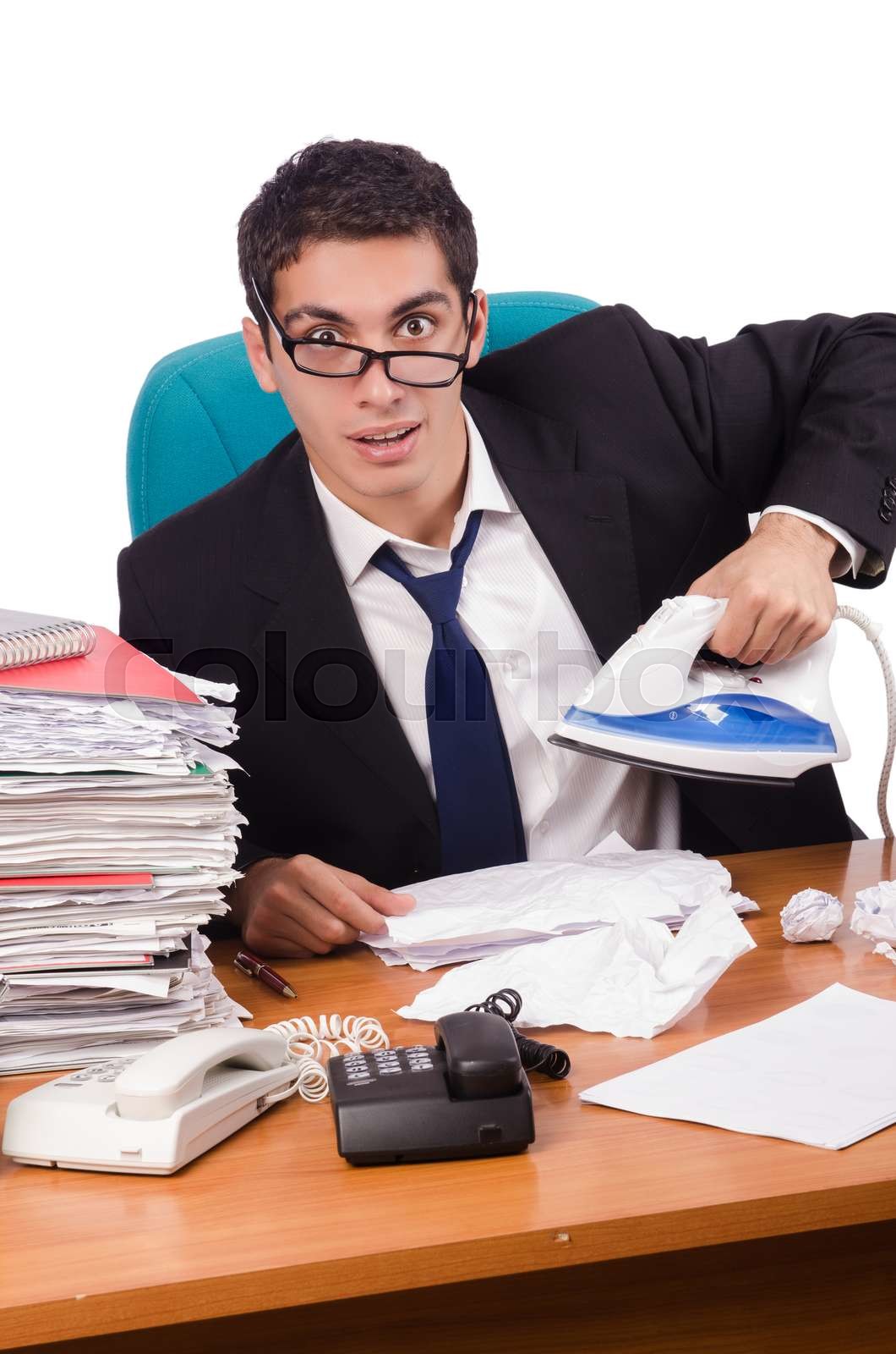 Busy businessman under work stress | Stock image | Colourbox