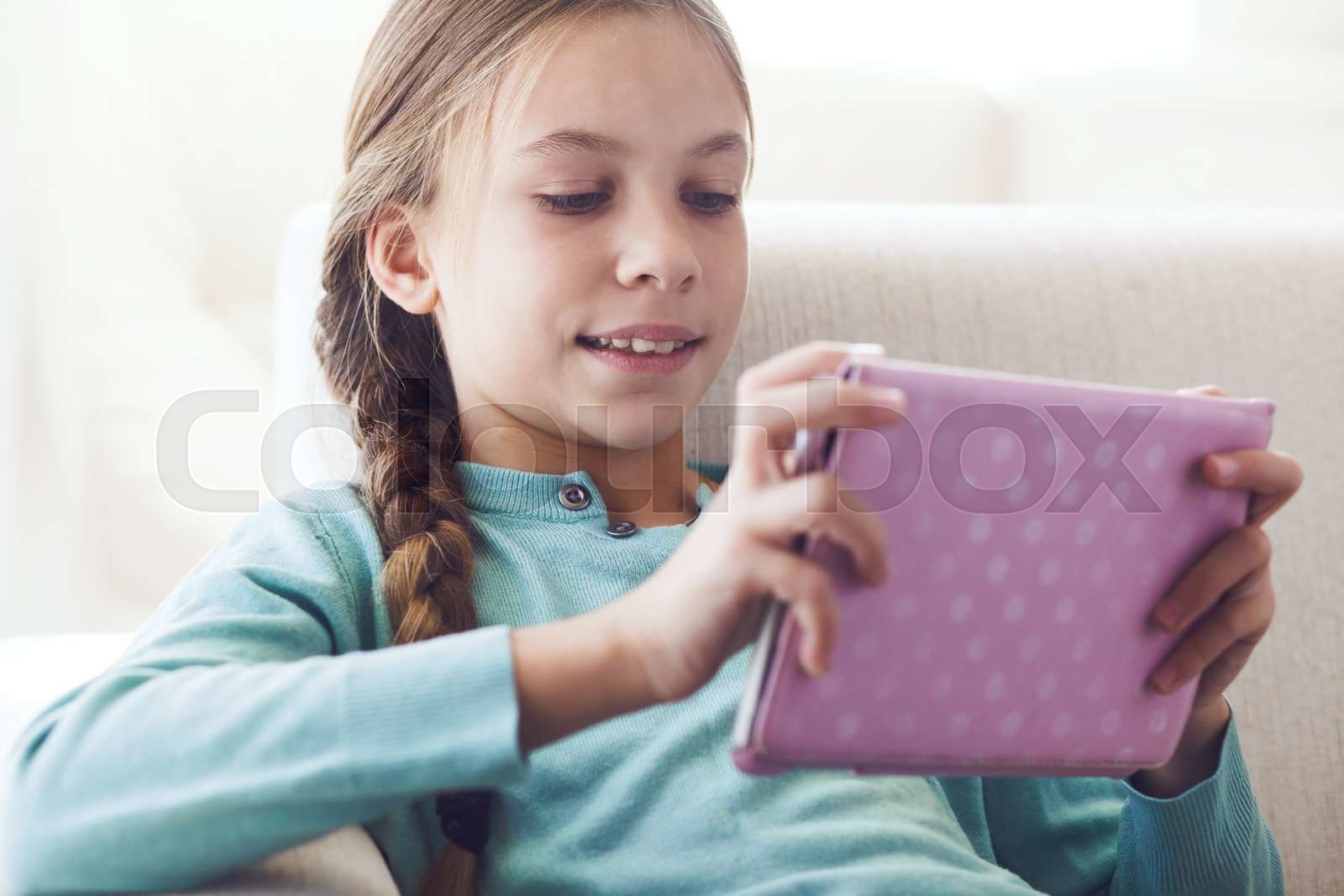 Child using ipad | Stock image | Colourbox
