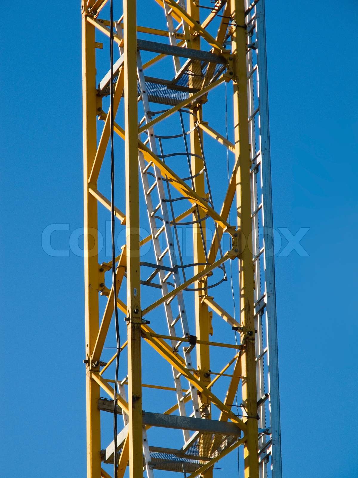 Detail of the stairs of a yellow hoisting tower crane | Stock image ...